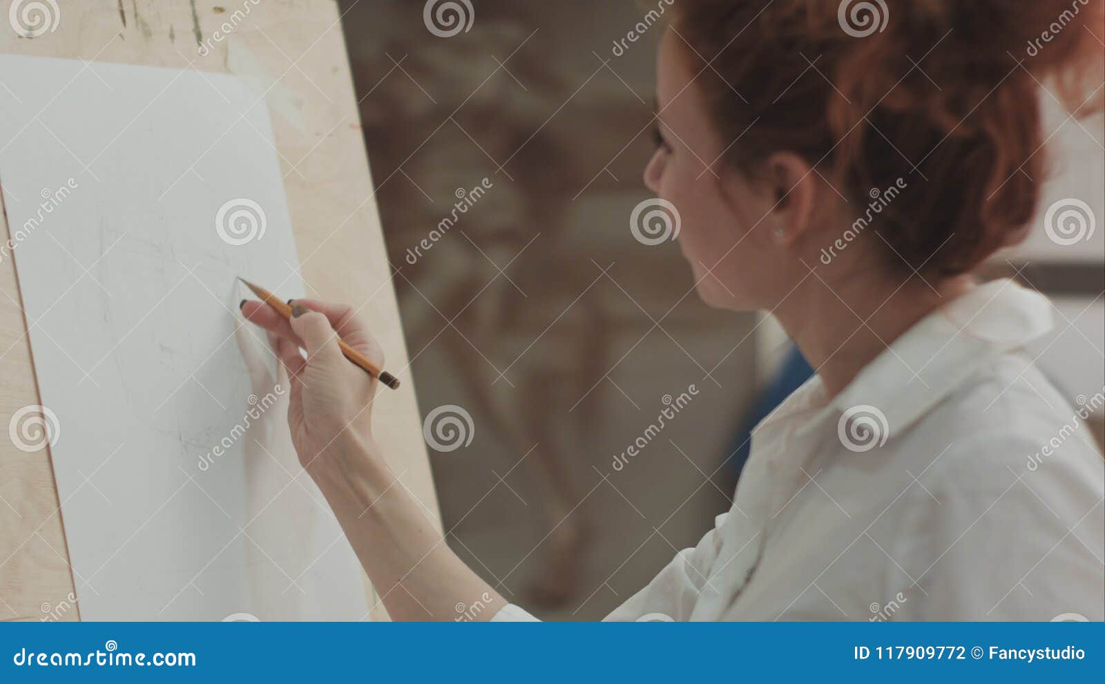 Young Woman Drawing in Pencil Using Easel and Explaining the Process ...