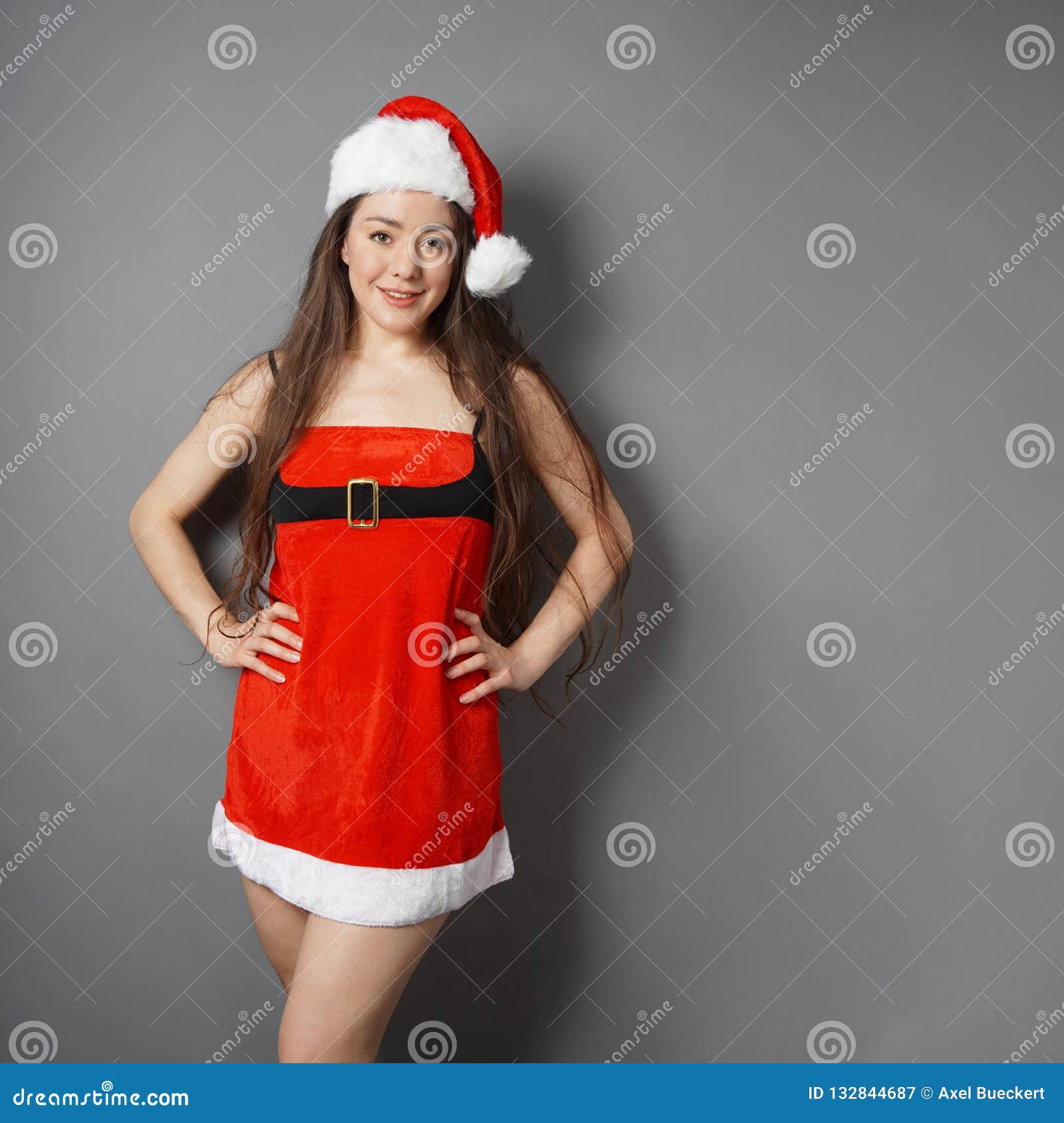 Young Woman Dressed As Miss Santa In Christmas Costume Stock Image