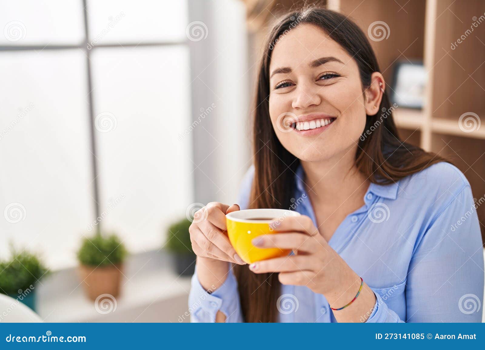 Young Woman Drinking Coffee Sitting on Table at Home Stock Image ...
