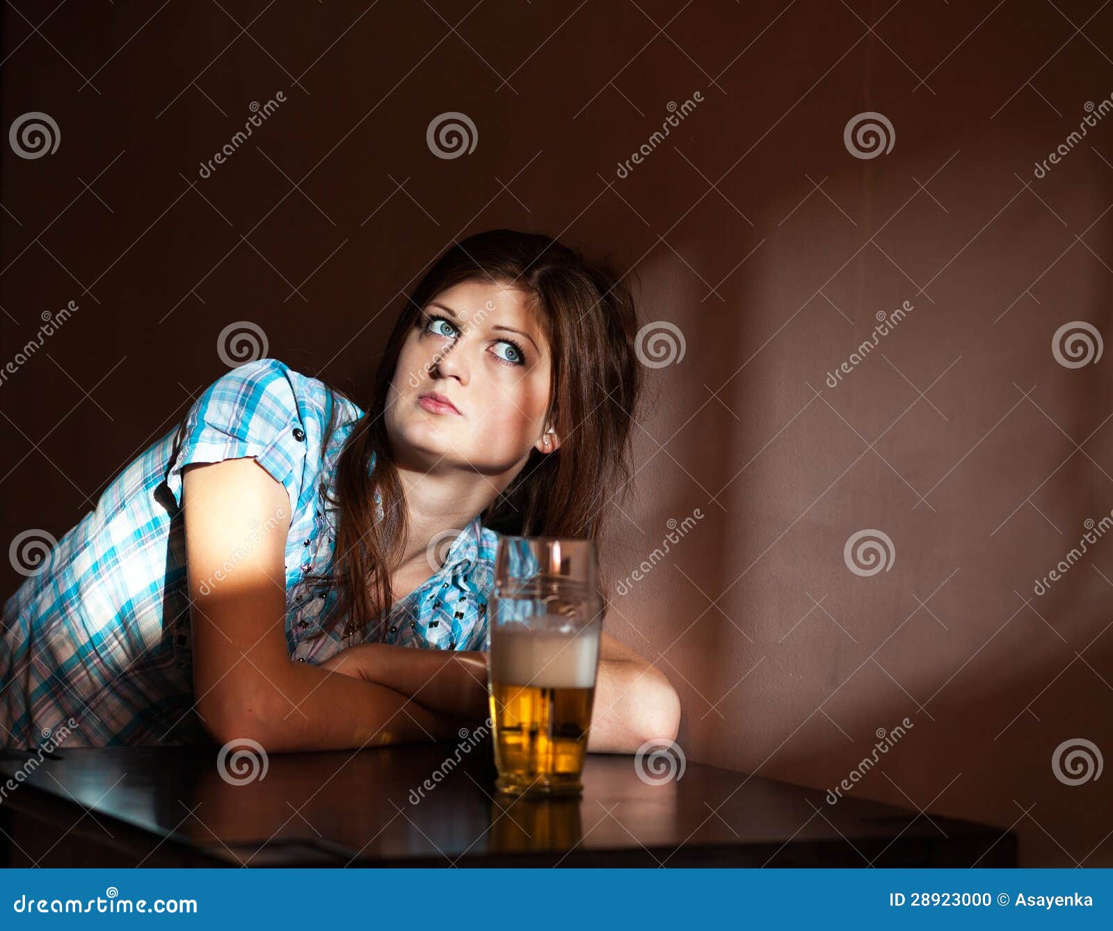 Young woman drinking lager stock photo. Image of female - 28923000
