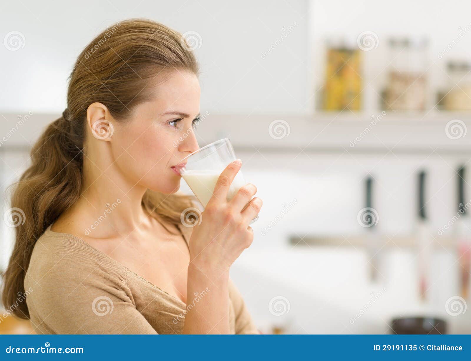 Young Woman Drinking Milk in Modern Kitchen Stock Image - Image of ...