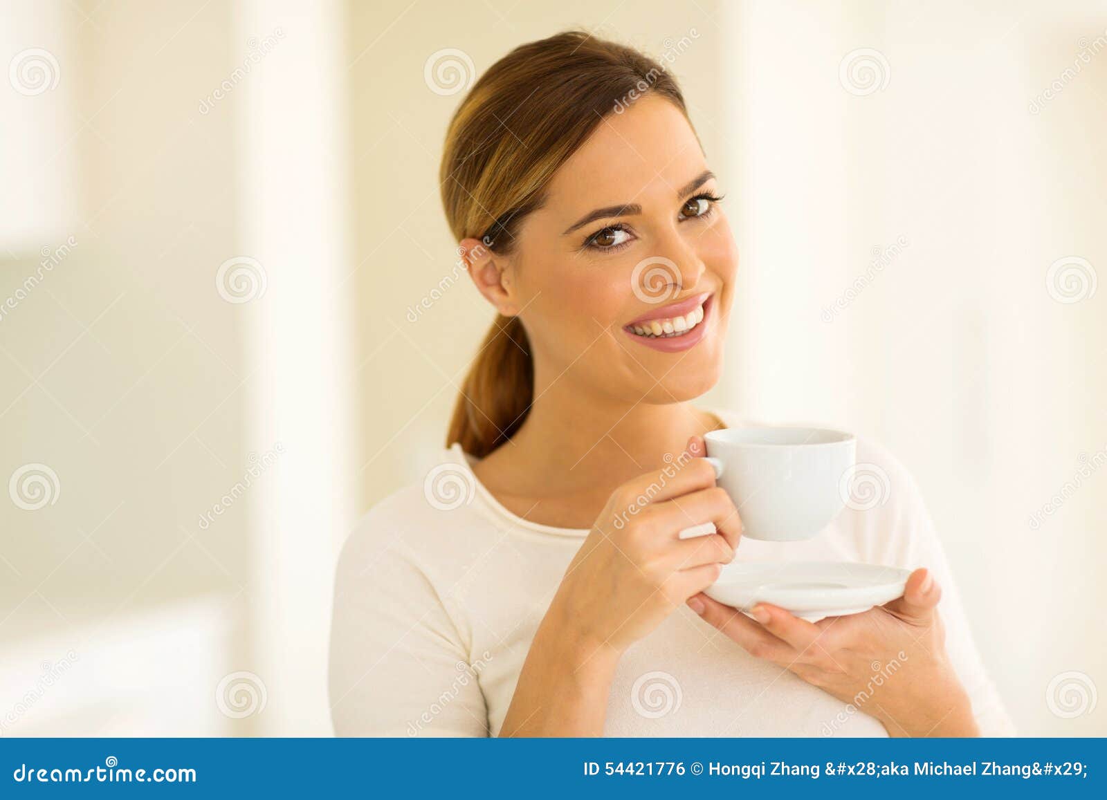 Young woman drinking tea stock photo. Image of standing - 54421776