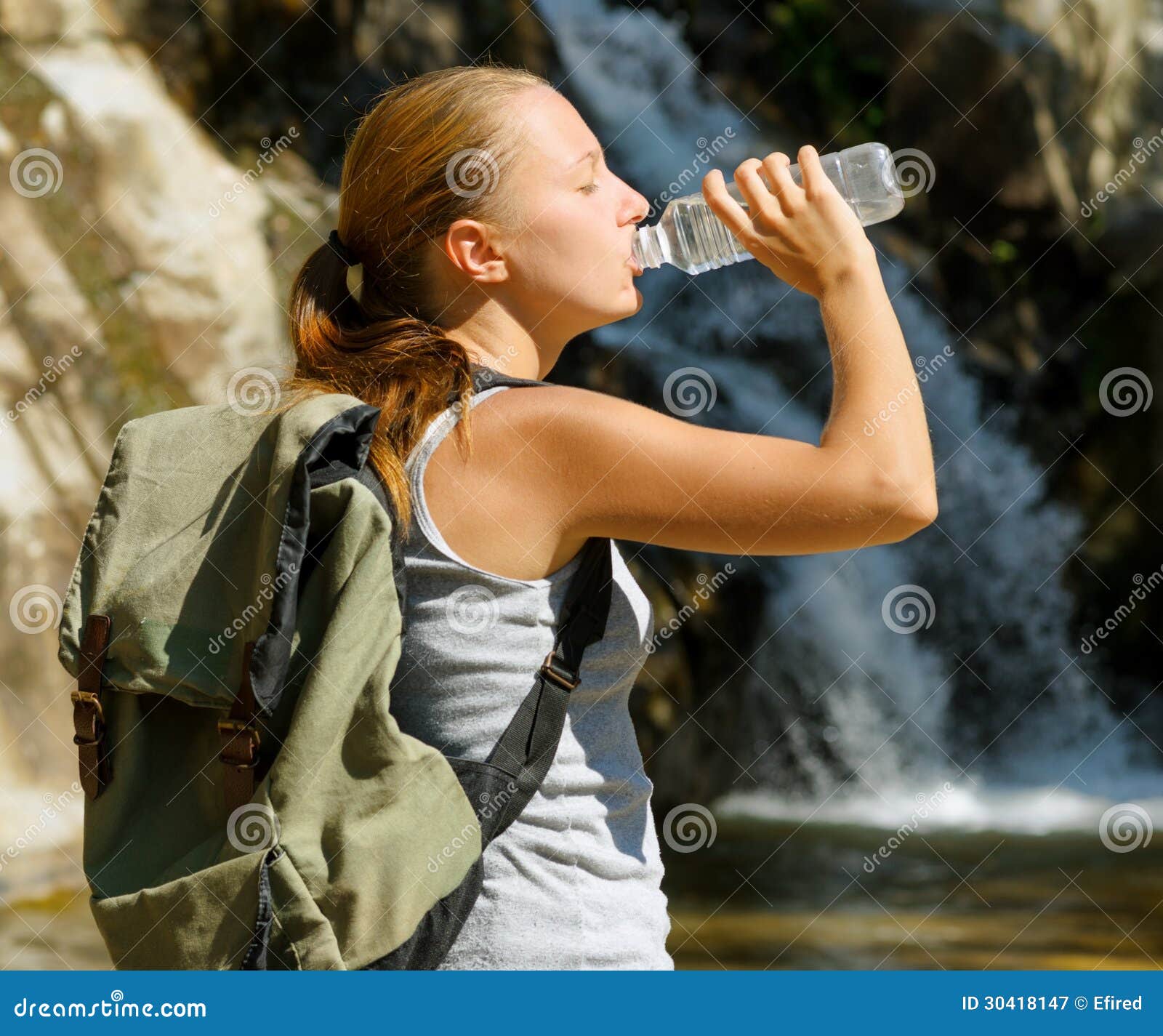 Young Woman Drinks Water by Waterfall Stock Image - Image of fitness ...