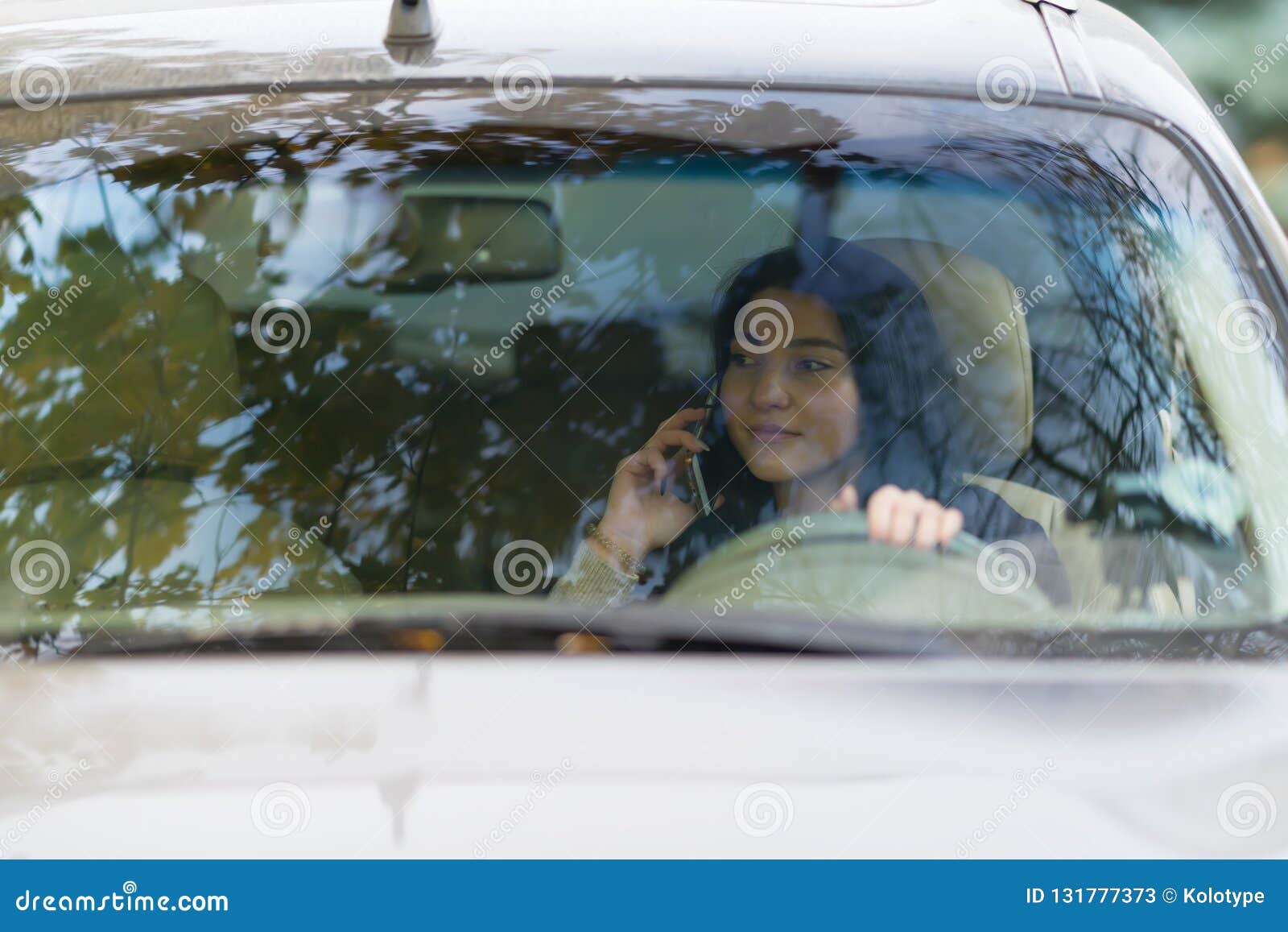Young Woman Driver Chatting on Her Mobile. Stock Image - Image of ...