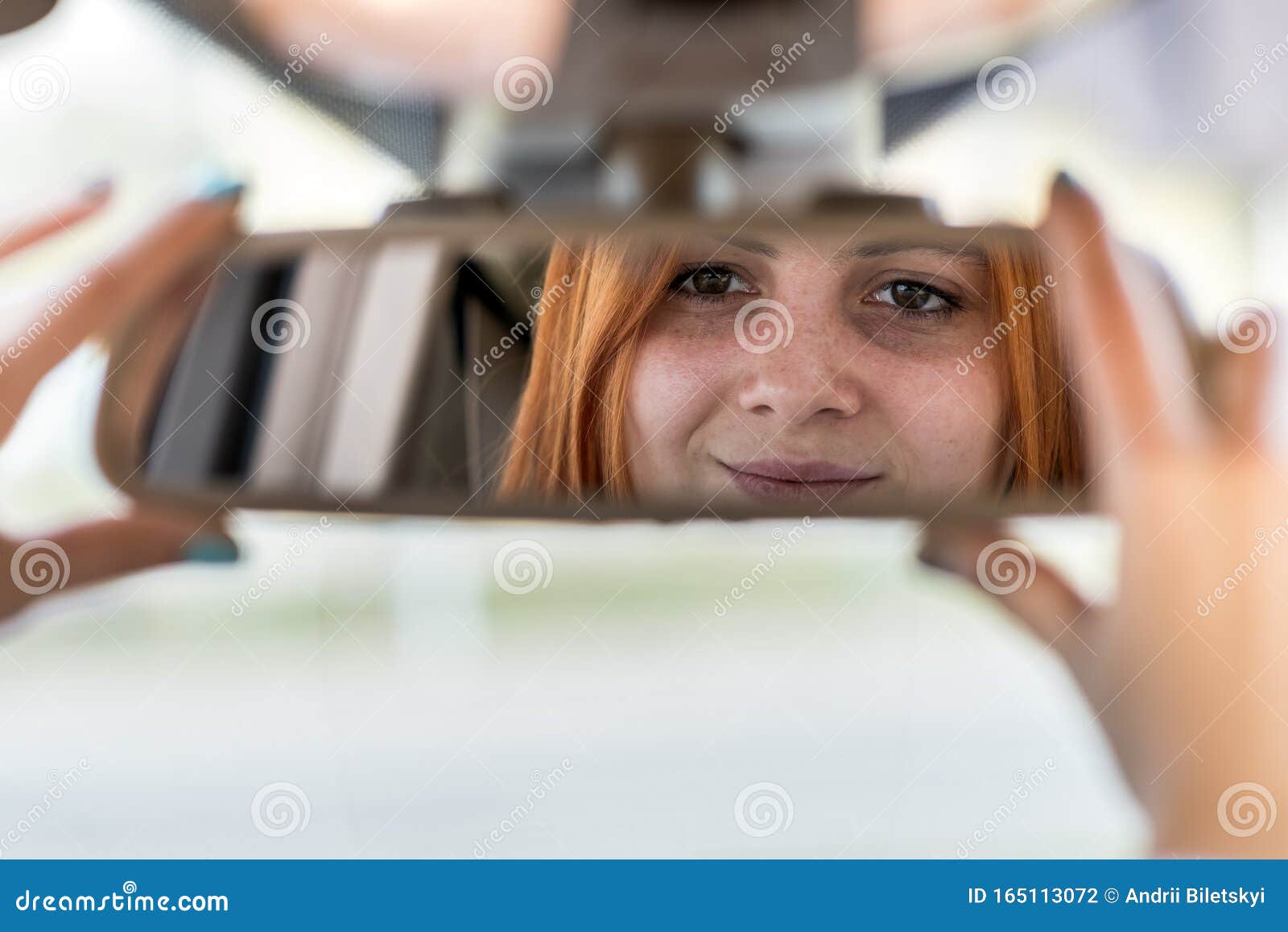 Young Woman Driver Checking Rear View Mirror Looking Backwards while ...