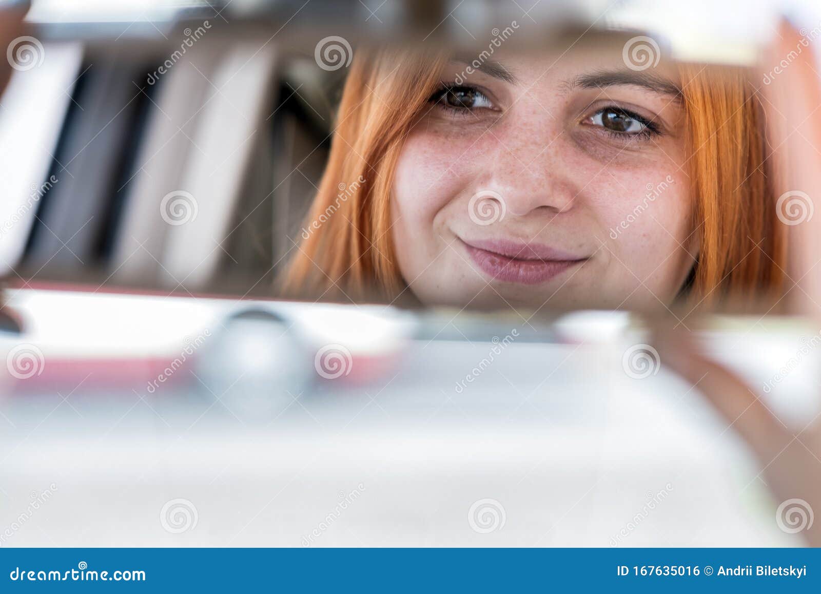 Young Woman Driver Checking Rear View Mirror Looking Backwards while ...