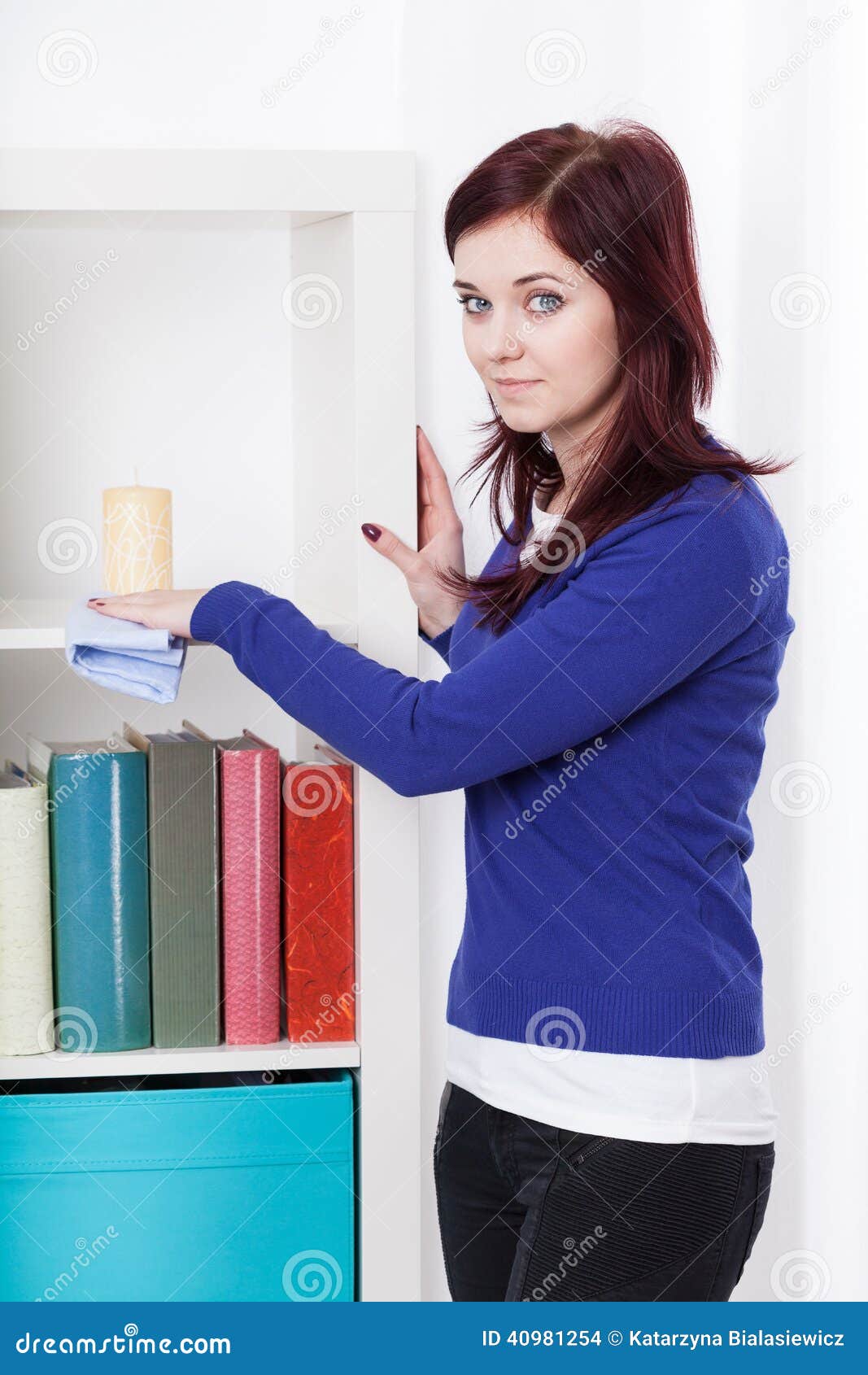 Young Woman Dusting a Bookcase Stock Photo - Image of adult, housework ...