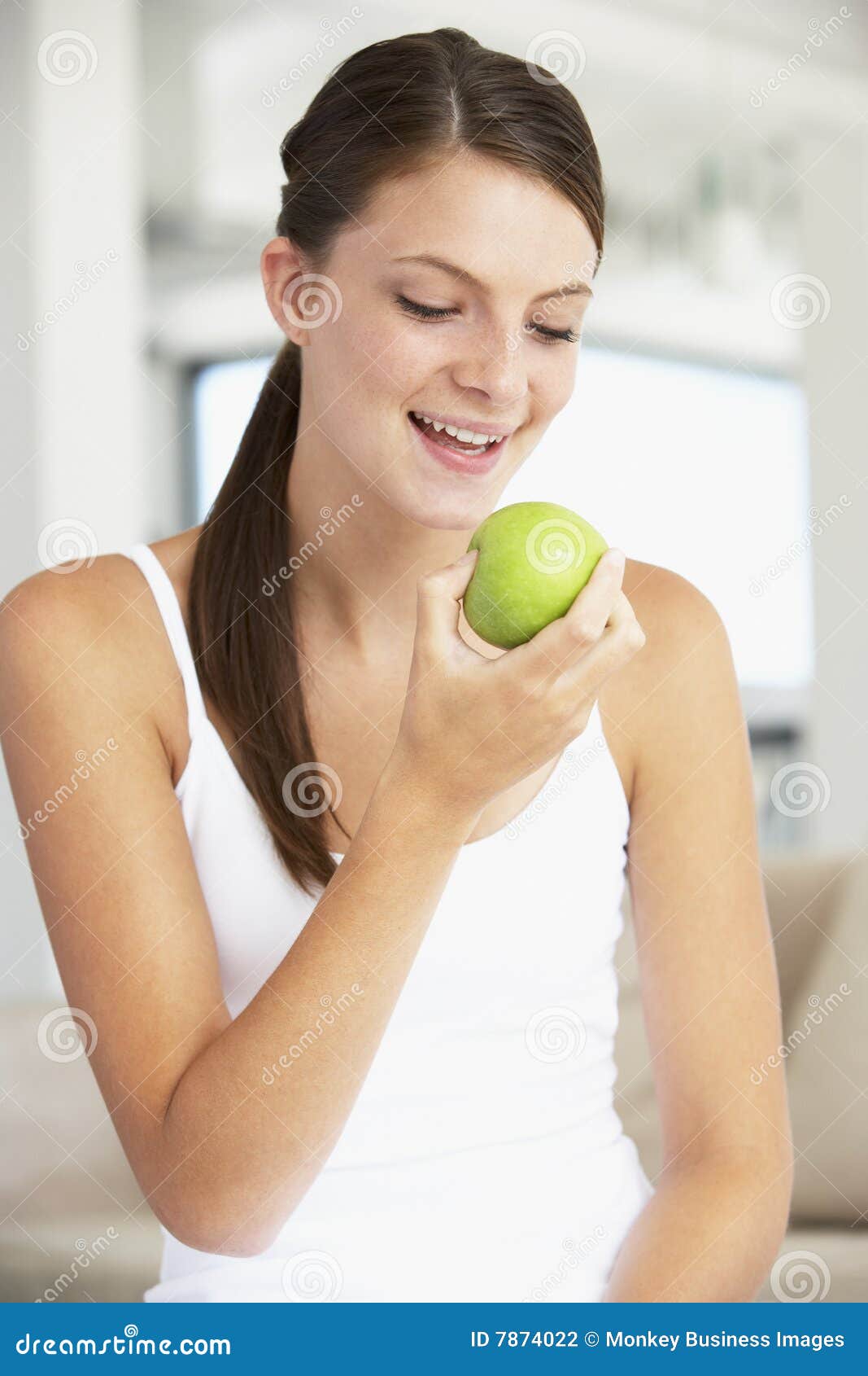 Young Woman Eating an Apple Stock Photo - Image of hair, eating: 7874022