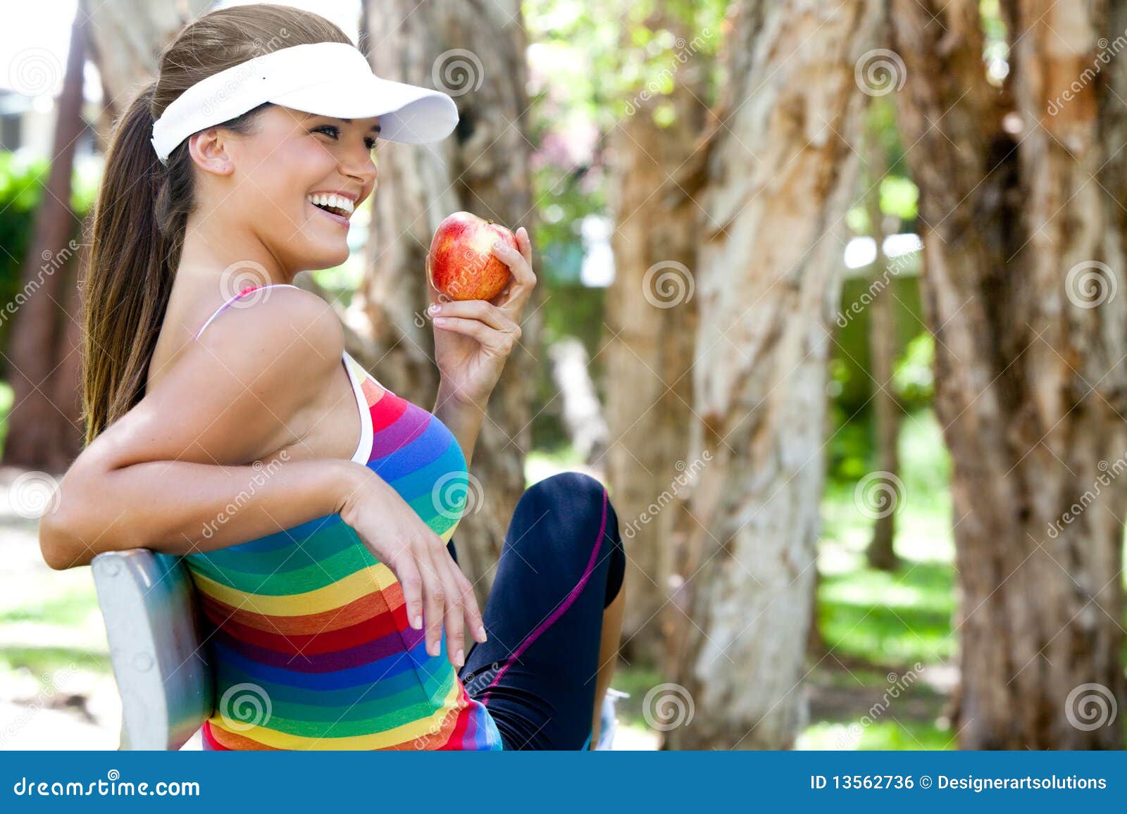 Young Woman Eating Apple on Park Bench Stock Photo - Image of female ...
