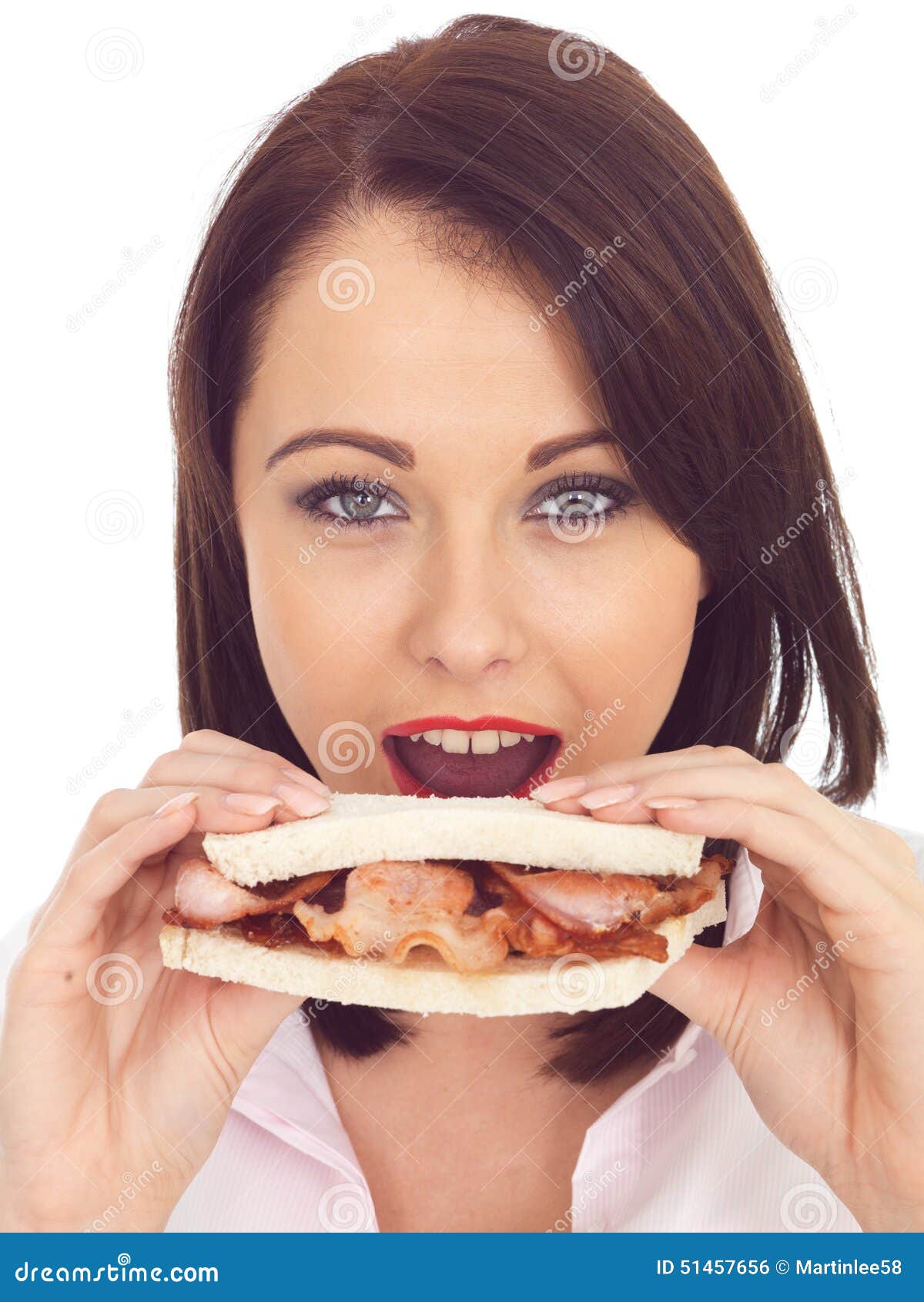 Young Woman Eating a Bacon Sandwich Stock Photo - Image of holding ...