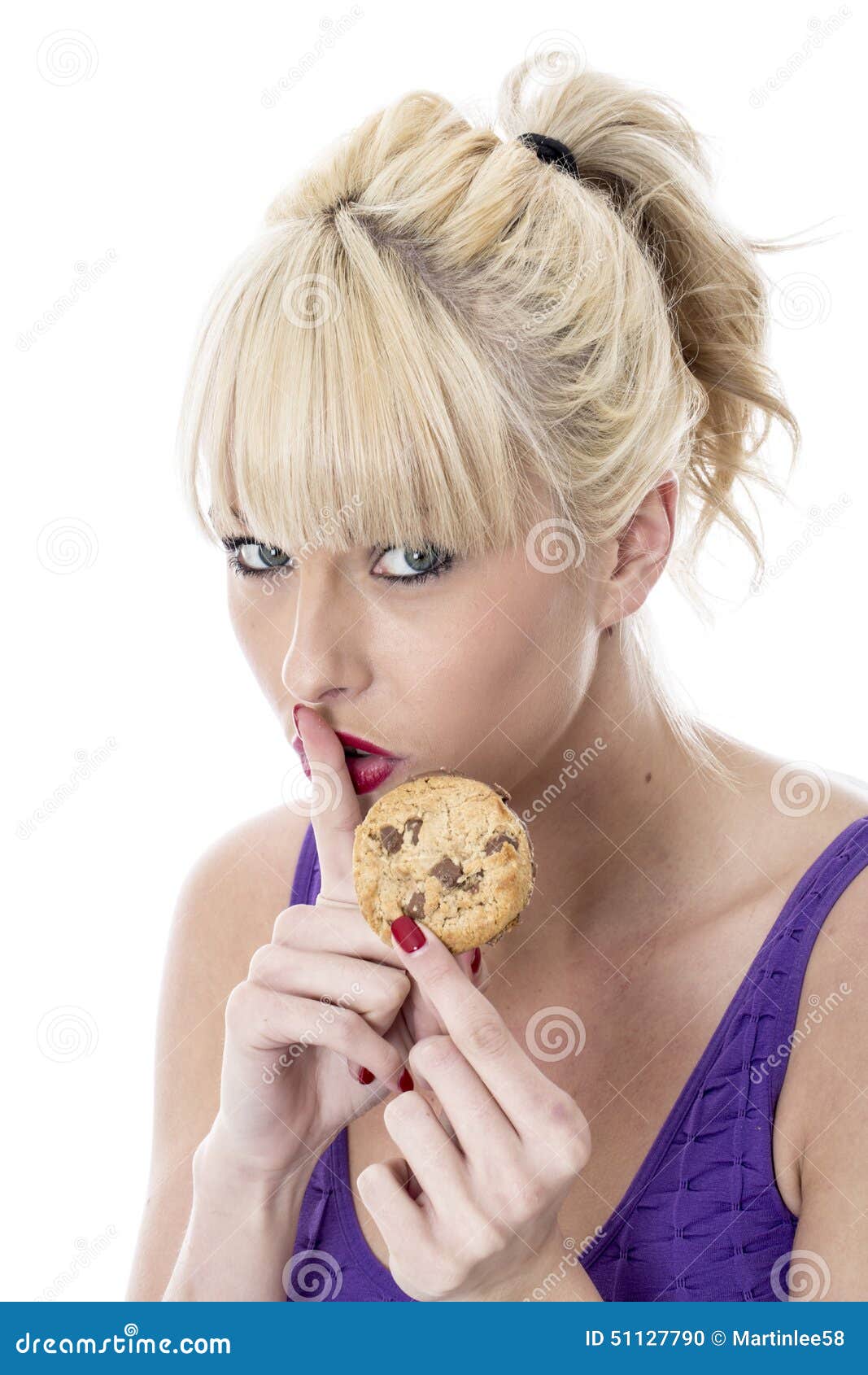 Young Woman Eating a Biscuit Stock Photo - Image of secretly, young ...
