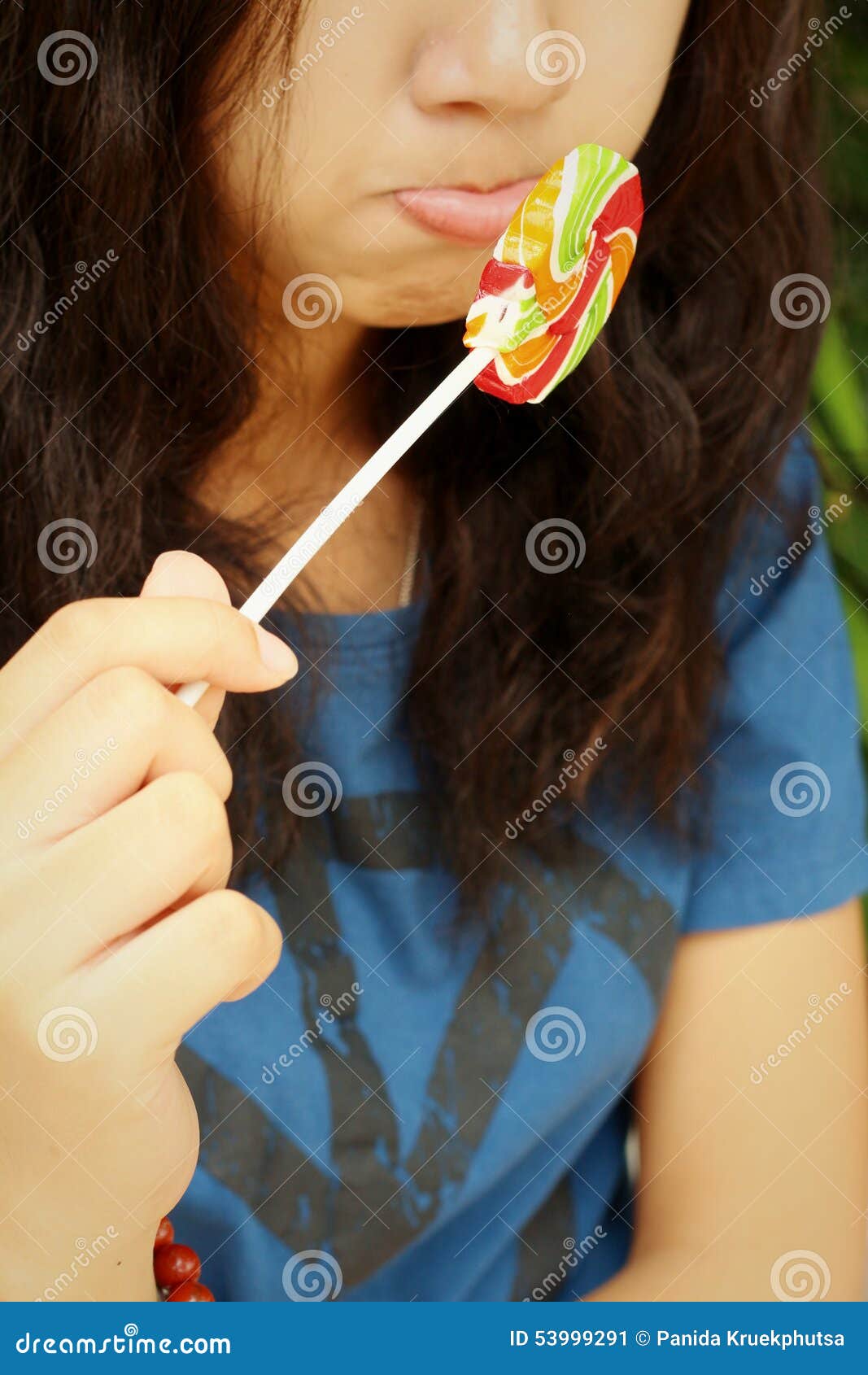 Young Woman Eating Candy at the Park. Stock Image - Image of enjoyment ...