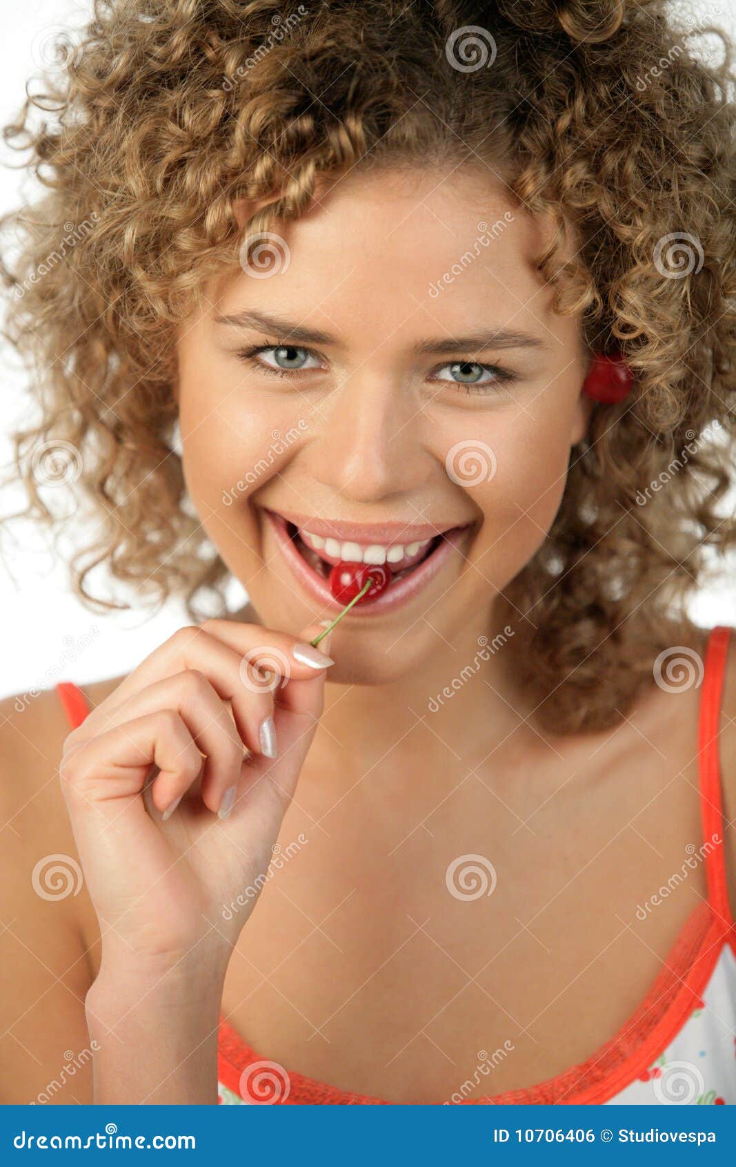 Young woman eating cherry stock photo. Image of hold - 10706406