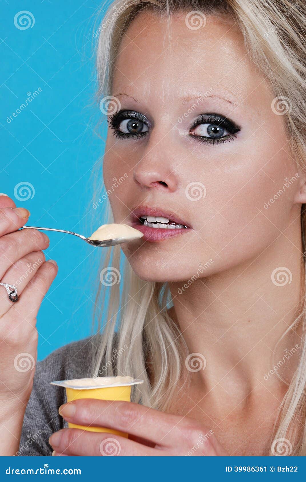 Young woman eating cream stock image. Image of woman - 39986361