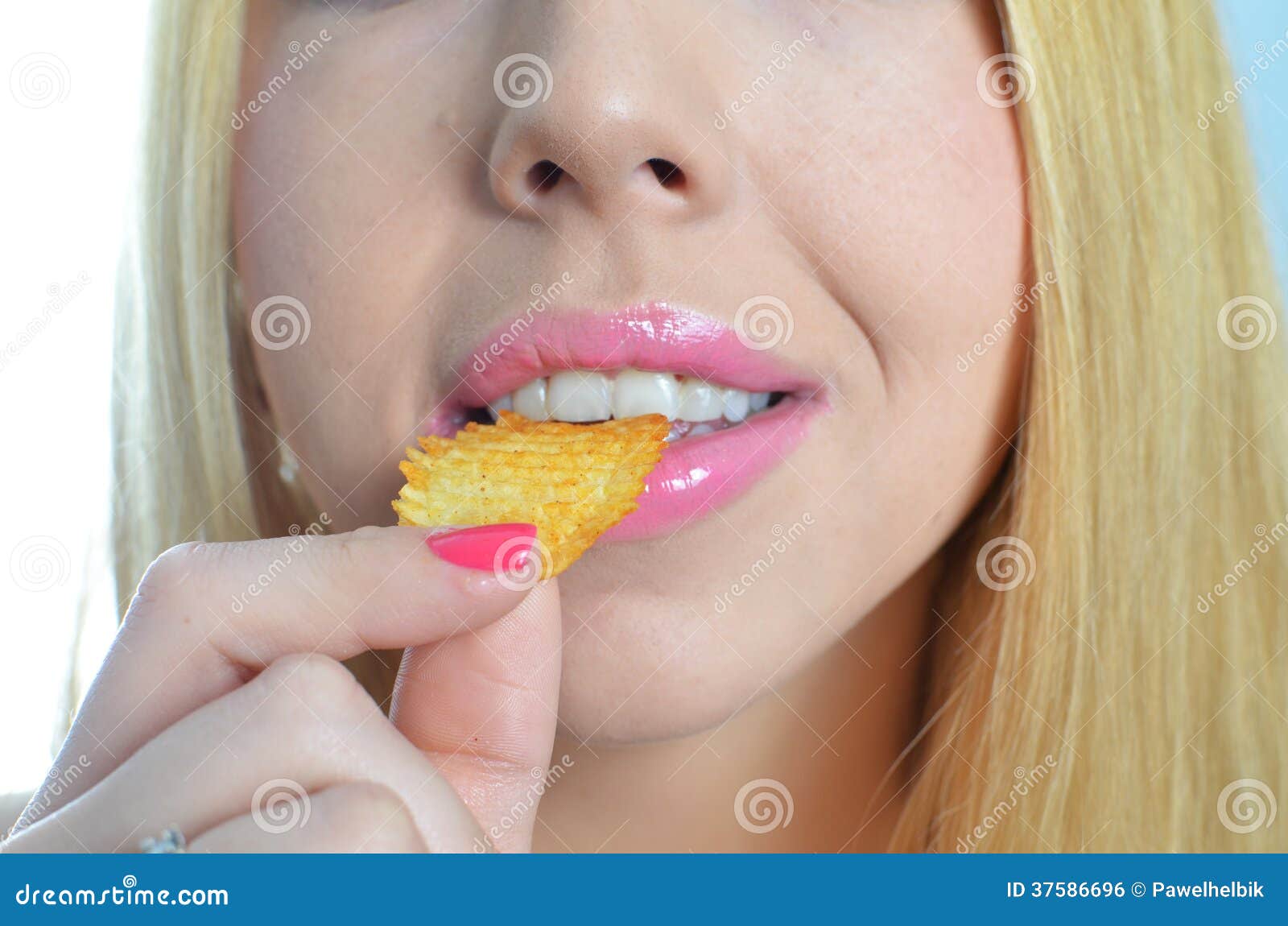 Young woman eating crisps stock photo. Image of indulgence - 37586696
