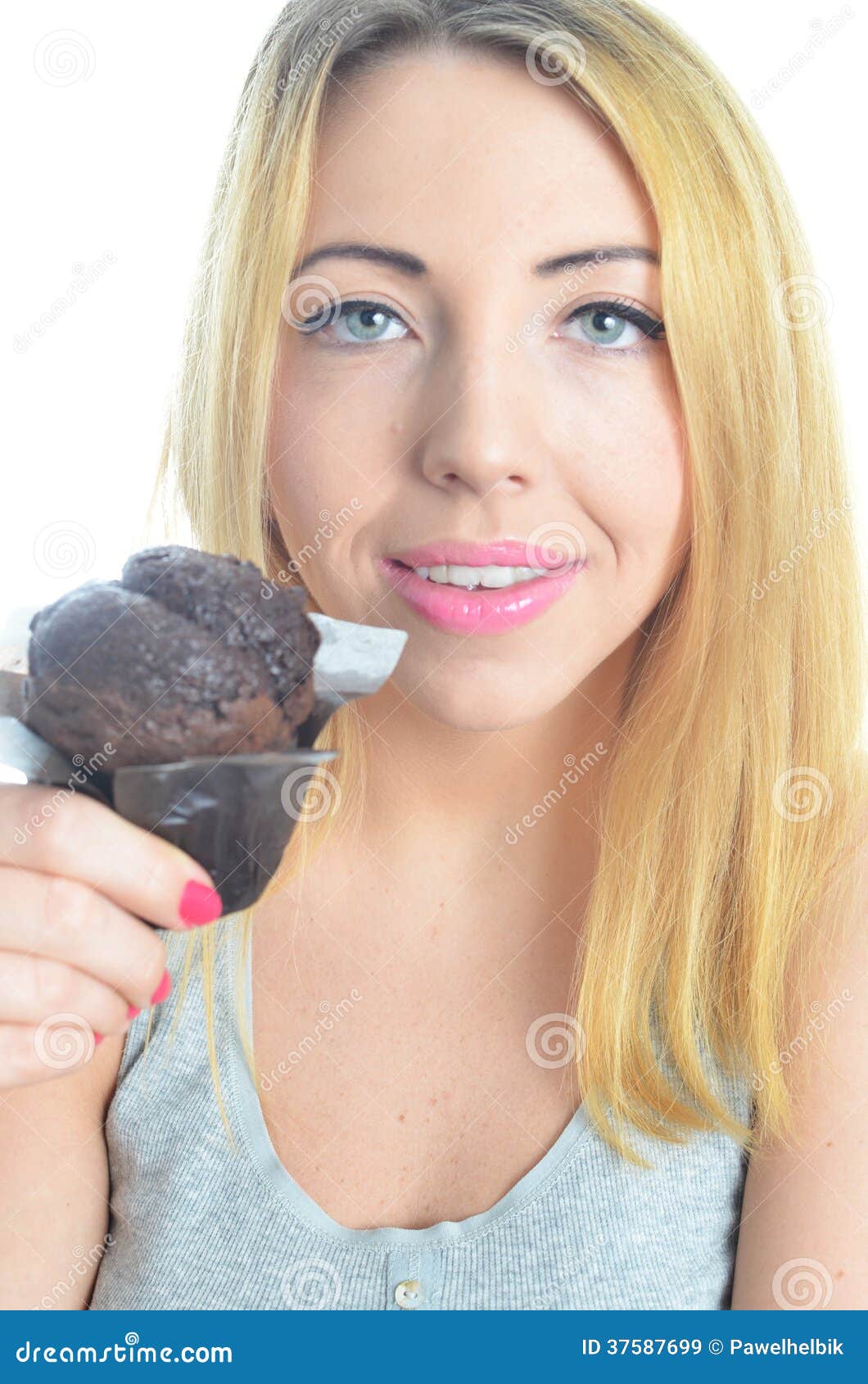 Young woman eating cupcake stock image. Image of indulging - 37587699