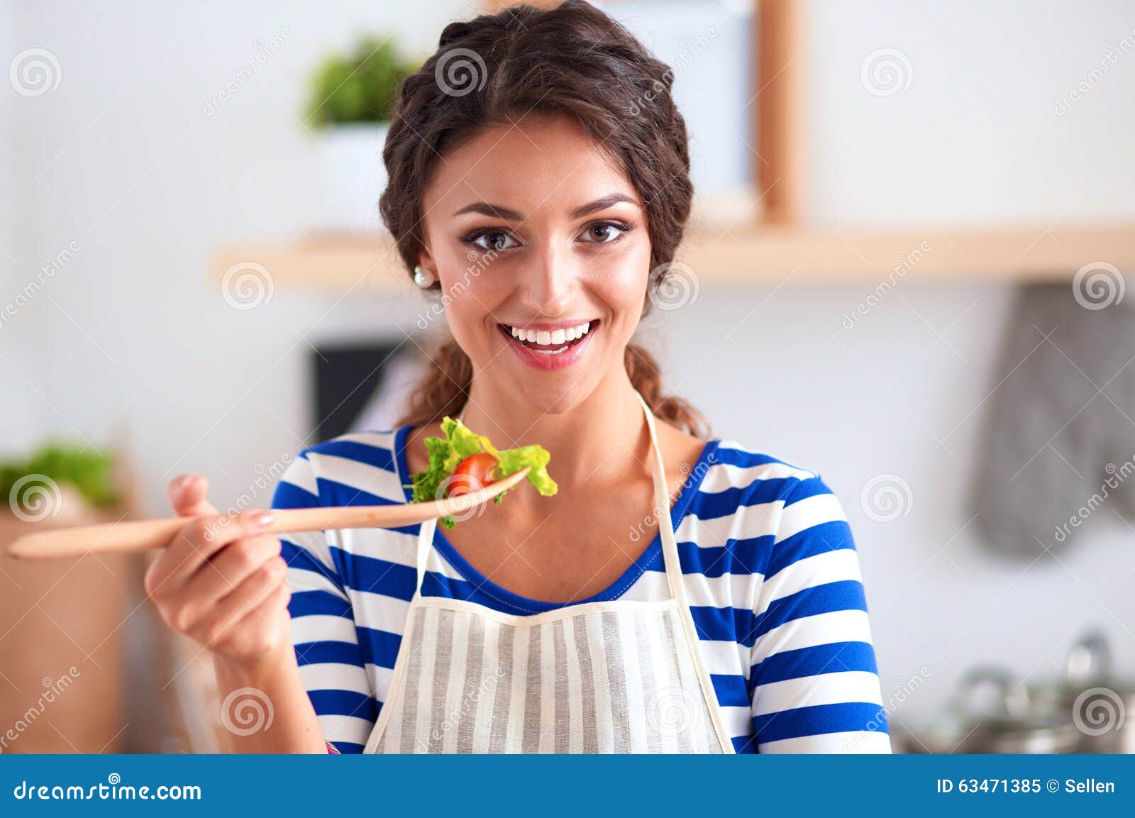 Young Woman Eating Fresh Salad in Modern Kitchen Stock Image - Image of ...