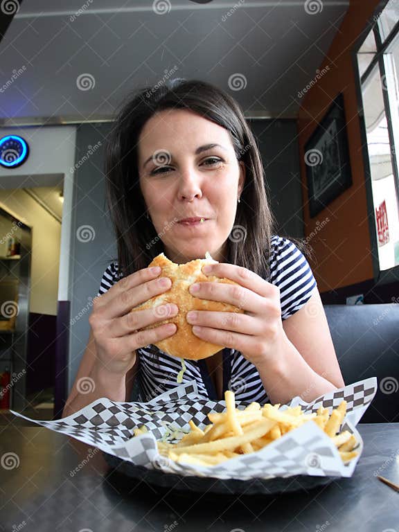 Young Woman Eating Hamburger Stock Image Image Of Hottie Cutie 5113537