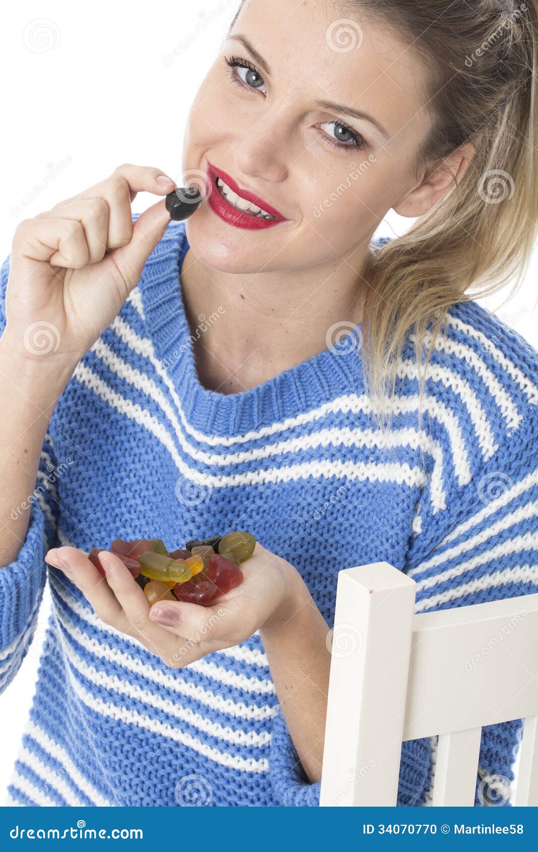 Young Woman Eating a Handful of Sweets Stock Photo - Image of sweets ...