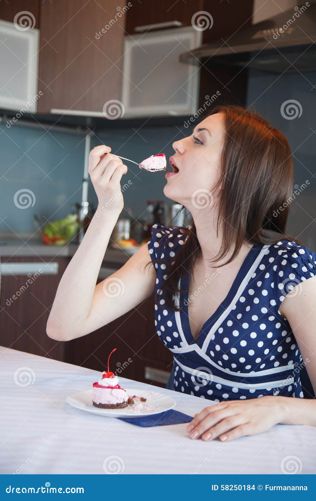 Young Woman is Eating Her Cake Stock Photo - Image of healthy, human ...