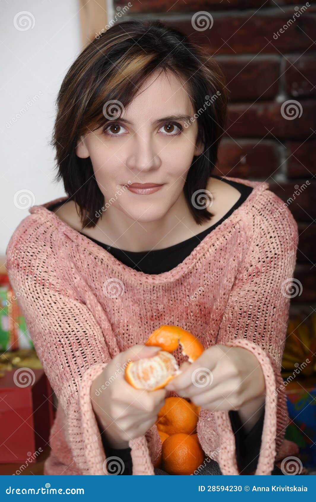 Young Woman Eating Mandarin Stock Photo - Image of hands, caucasian ...