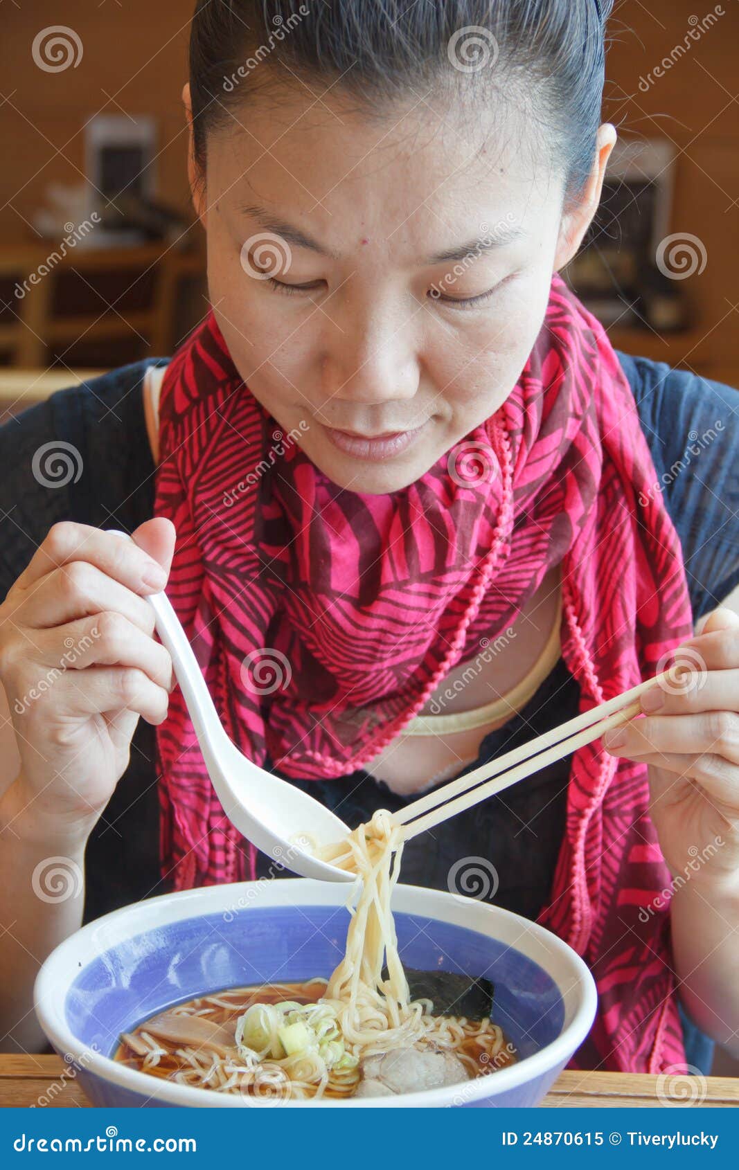 Young Woman Eating Noodles. Stock Image - Image of adult, holding: 24870615