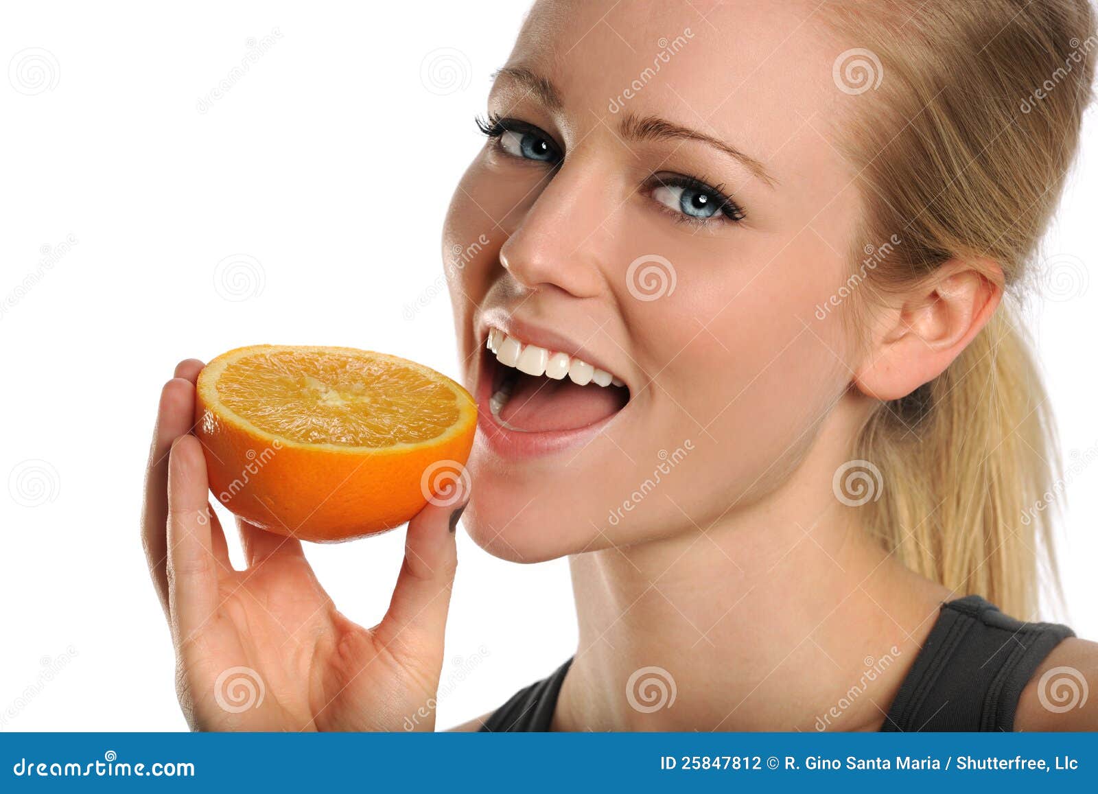 Young Woman Eating Orange stock photo. Image of blond - 25847812