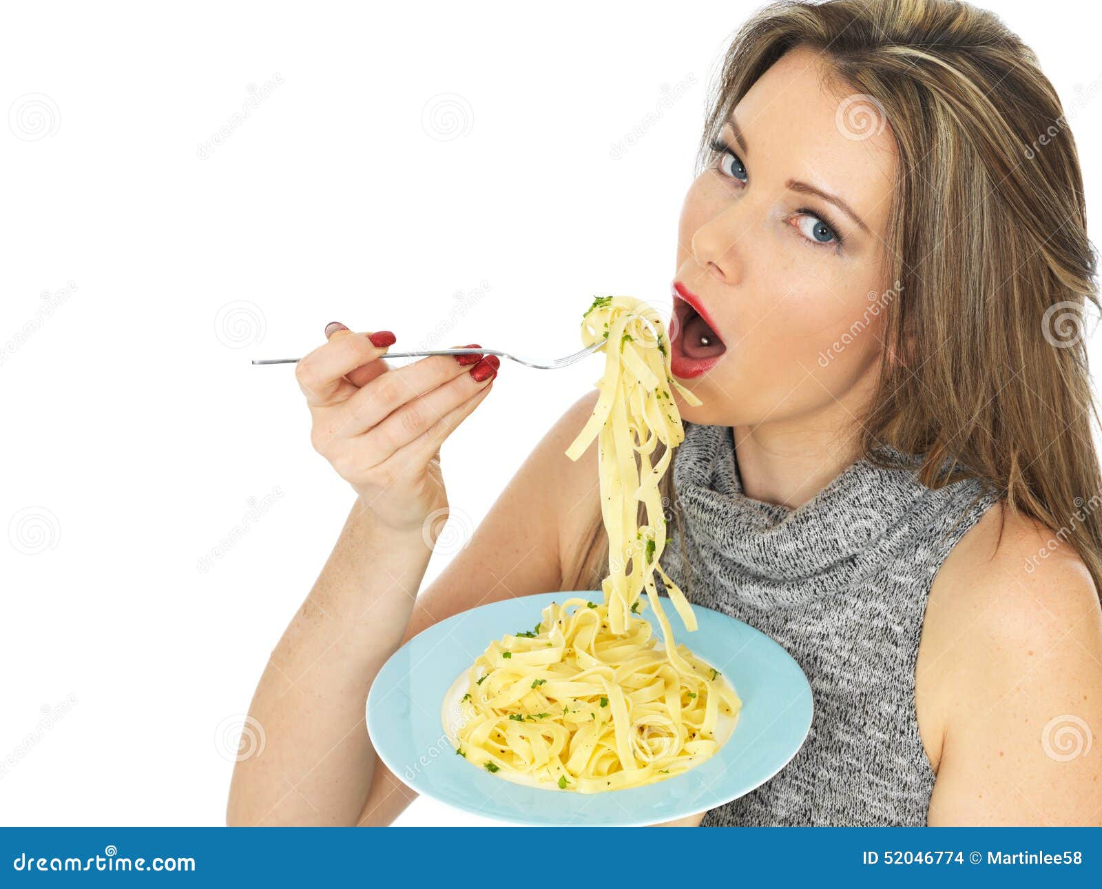 Young Woman Eating Pasta stock photo. Image of cooked - 52046774