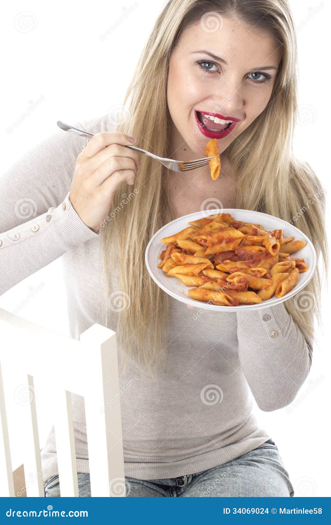 Young Woman Eating Penne Pasta Stock Photo - Image of twenties, italian ...