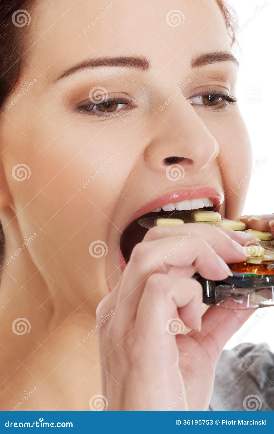 Young woman eating pills. stock image. Image of nurse - 36195753
