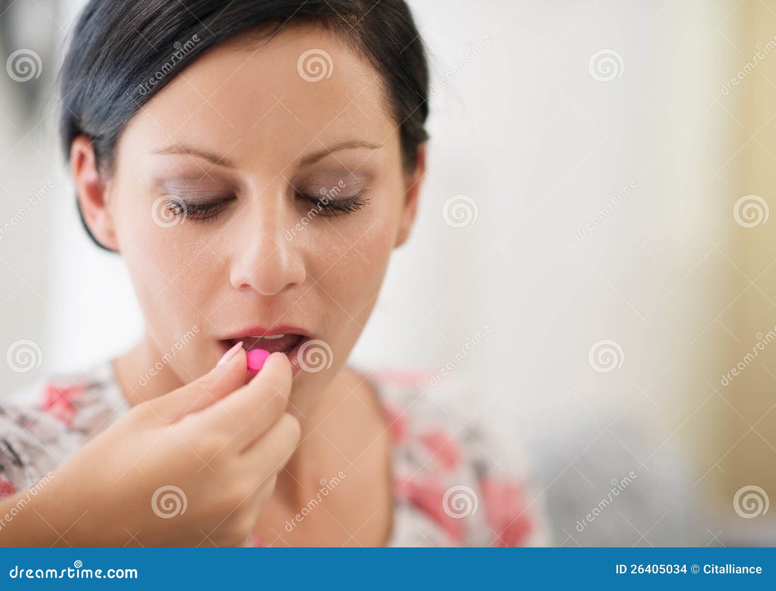 Young Woman Eating Pink Tablet Stock Photo - Image of health, casual ...
