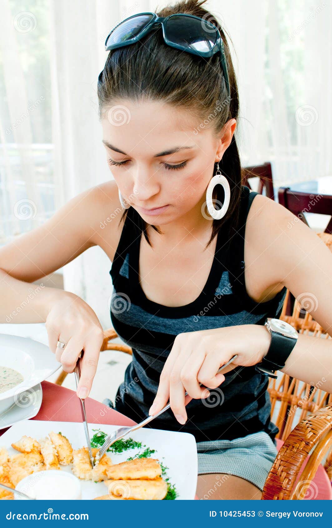 Young woman eating potato stock image. Image of adult - 10425453