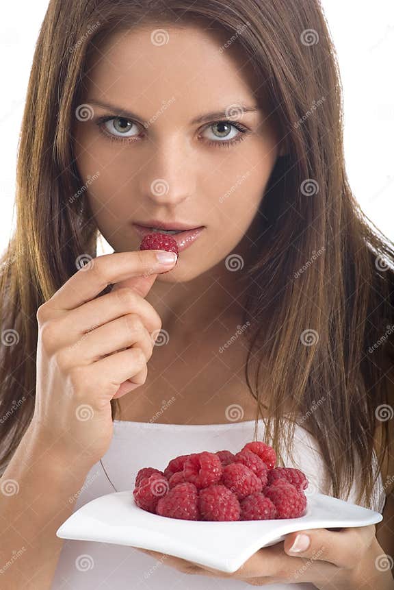Young Woman Eating Raspberry Stock Photo - Image of girl, juicy: 5834838