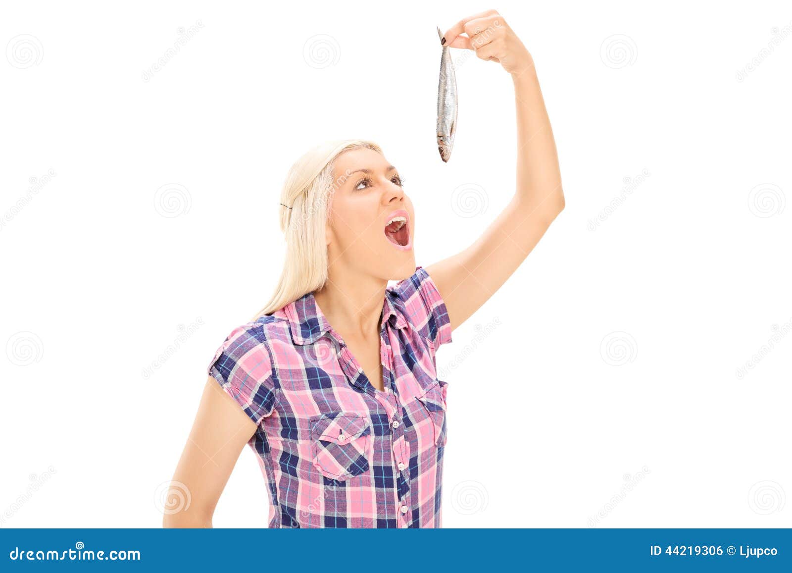 Young Woman Eating a Raw Fish Stock Photo - Image of person, blond ...