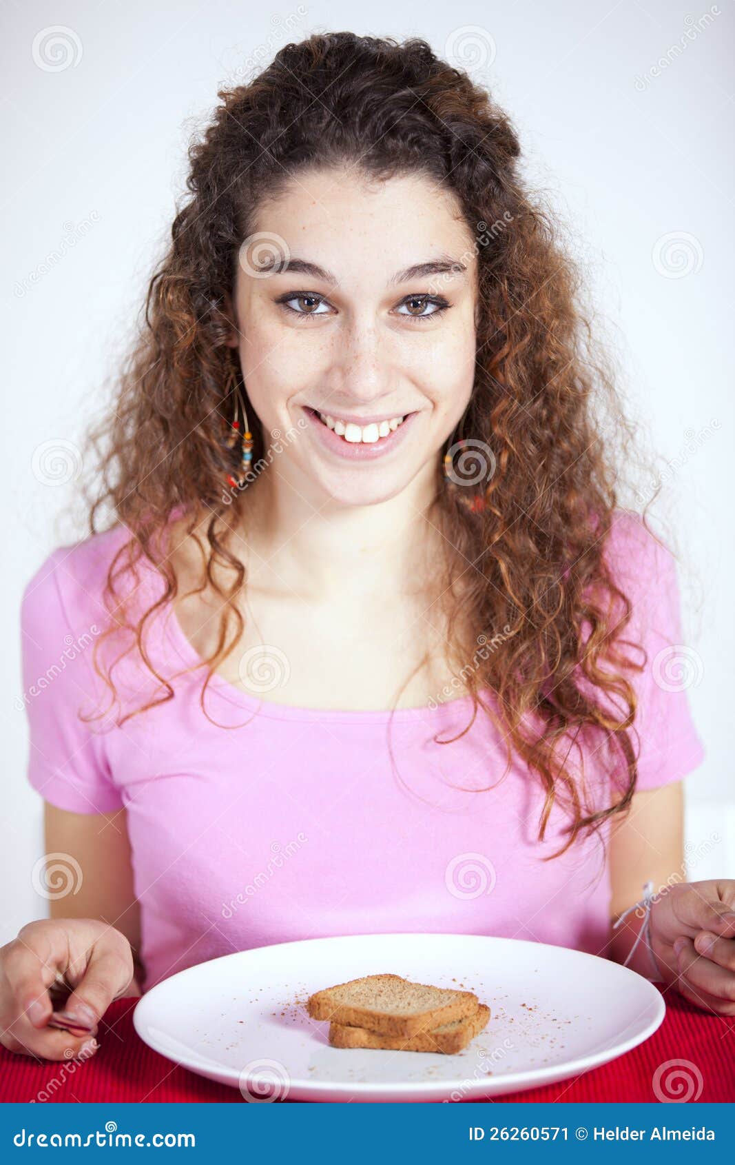 Young woman eating toast stock image. Image of face, diet - 26260571