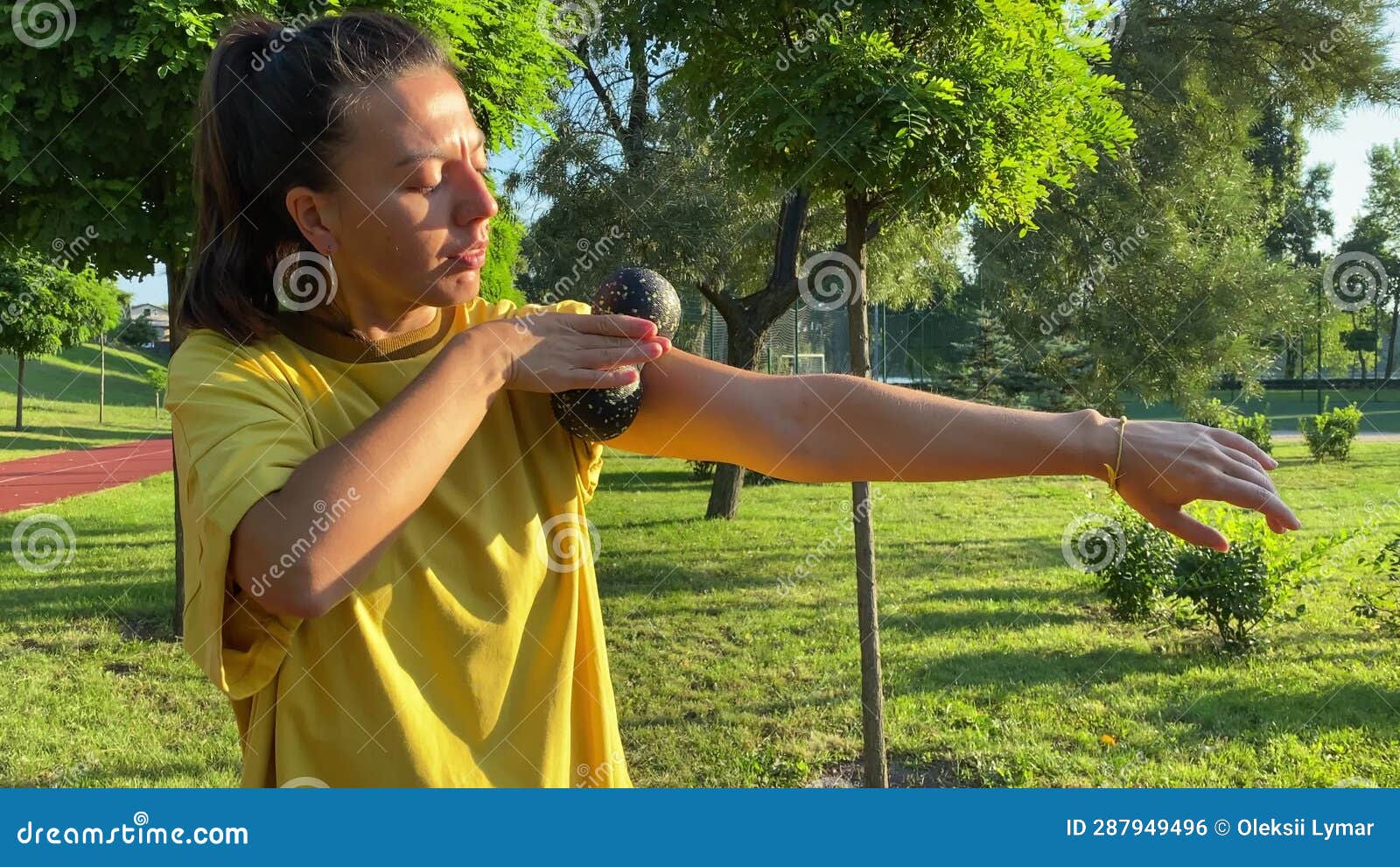 Young Woman Engages In Thorough Warm Up Routine In Public Park Stock Footage Video Of Sunlight 5297