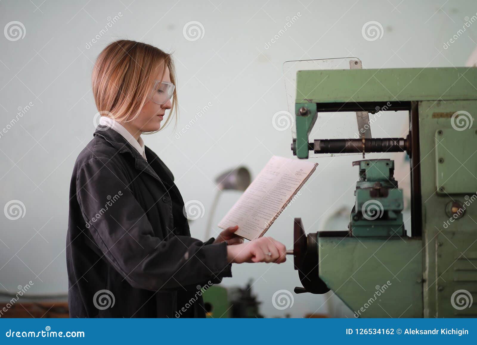 Young Woman Engineer Working at Machine Tool Stock Photo - Image of ...
