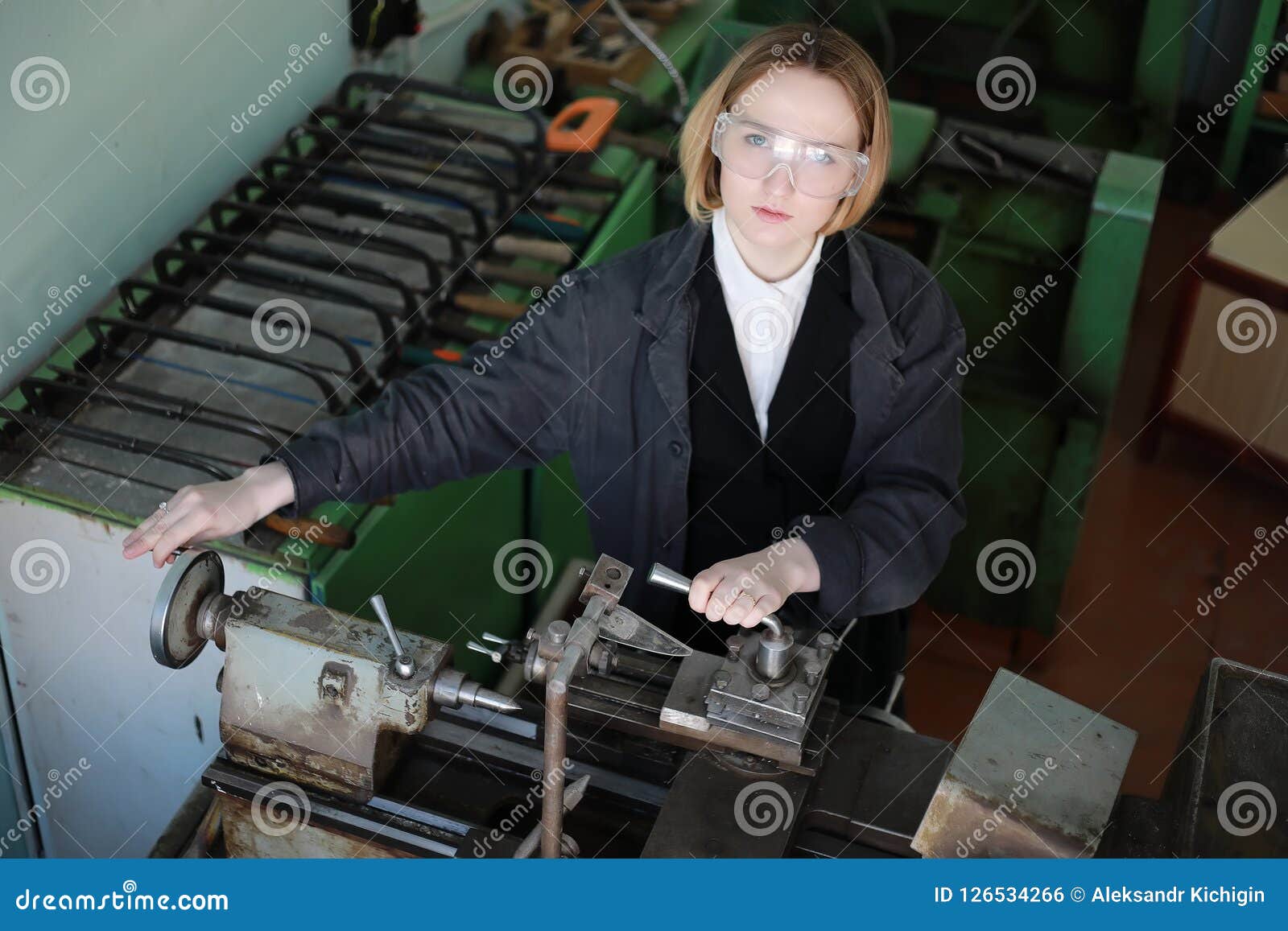 Young Woman Engineer Working at Machine Tool Stock Photo - Image of ...