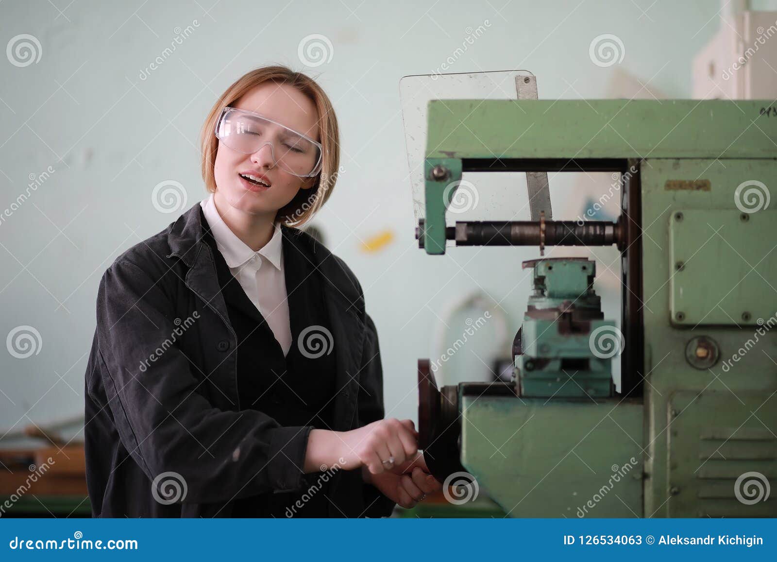 Young Woman Engineer Working at Machine Tool Stock Image - Image of ...