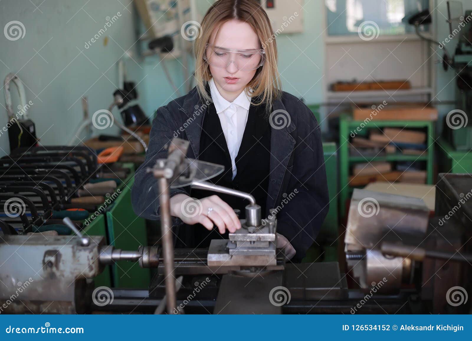 Young Woman Engineer Working at Machine Tool Stock Photo - Image of ...