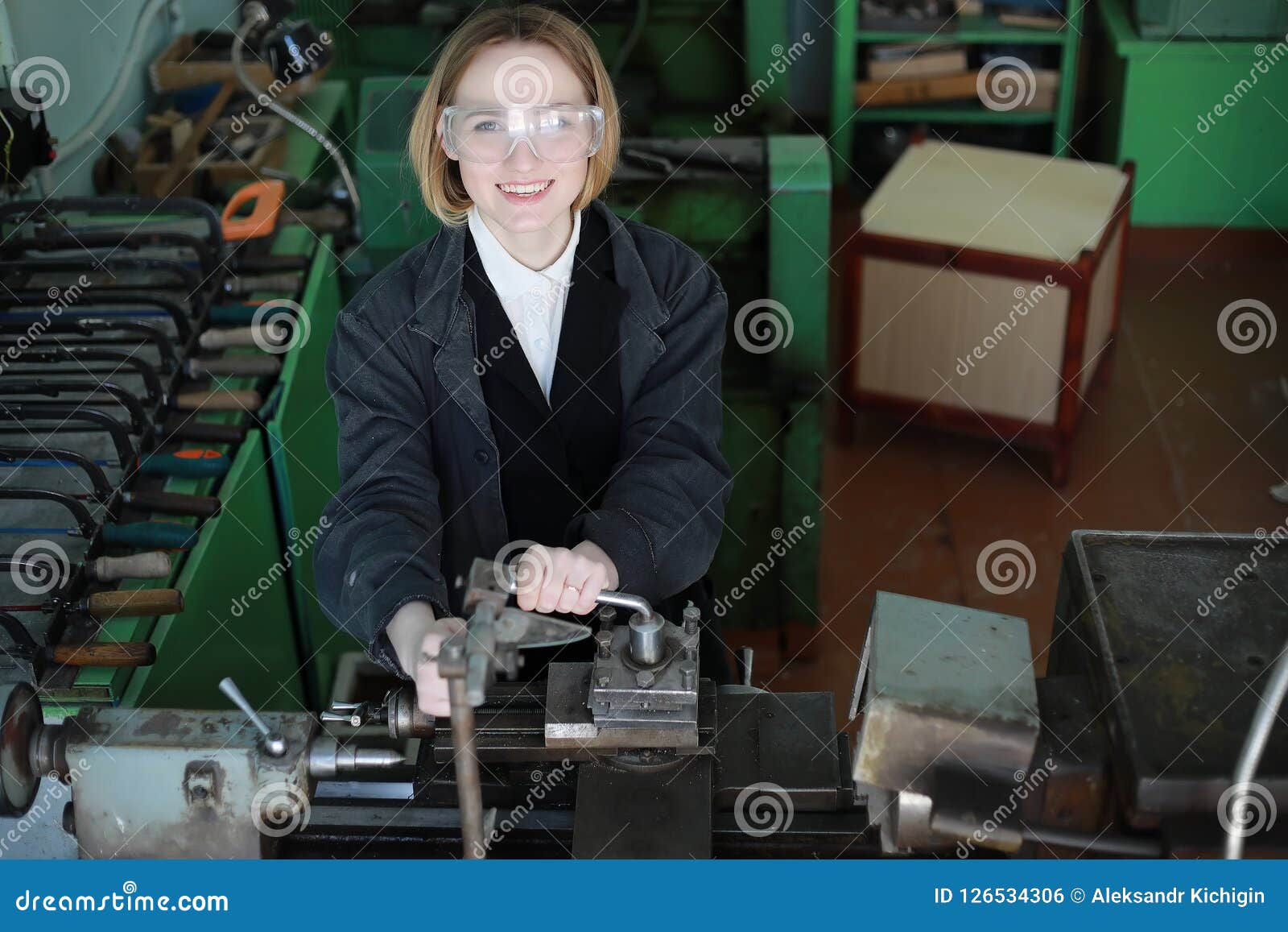 Young Woman Engineer Working at Machine Tool Stock Photo - Image of ...