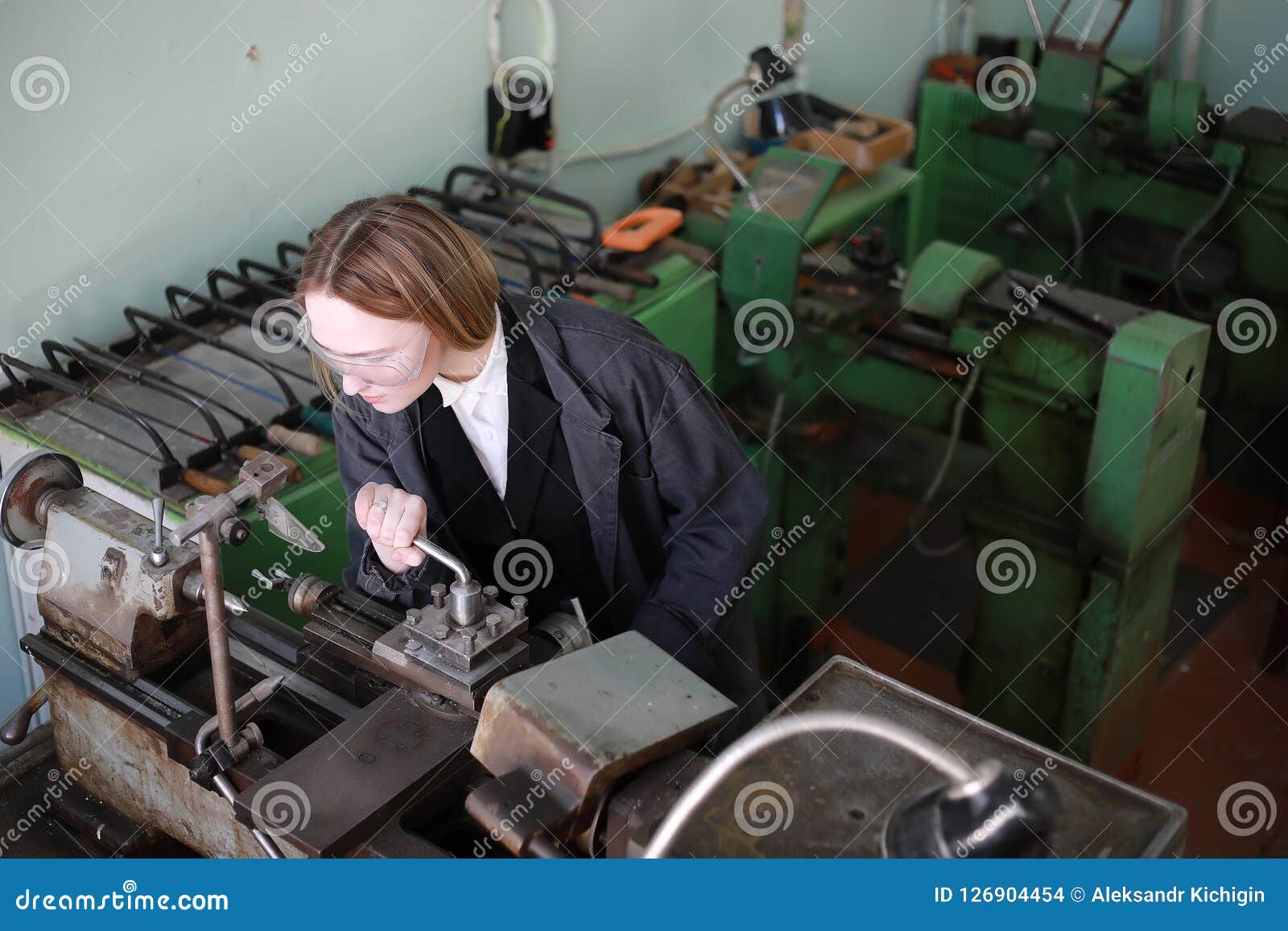 Young Woman Engineer Working at Machine Tool Stock Photo - Image of ...