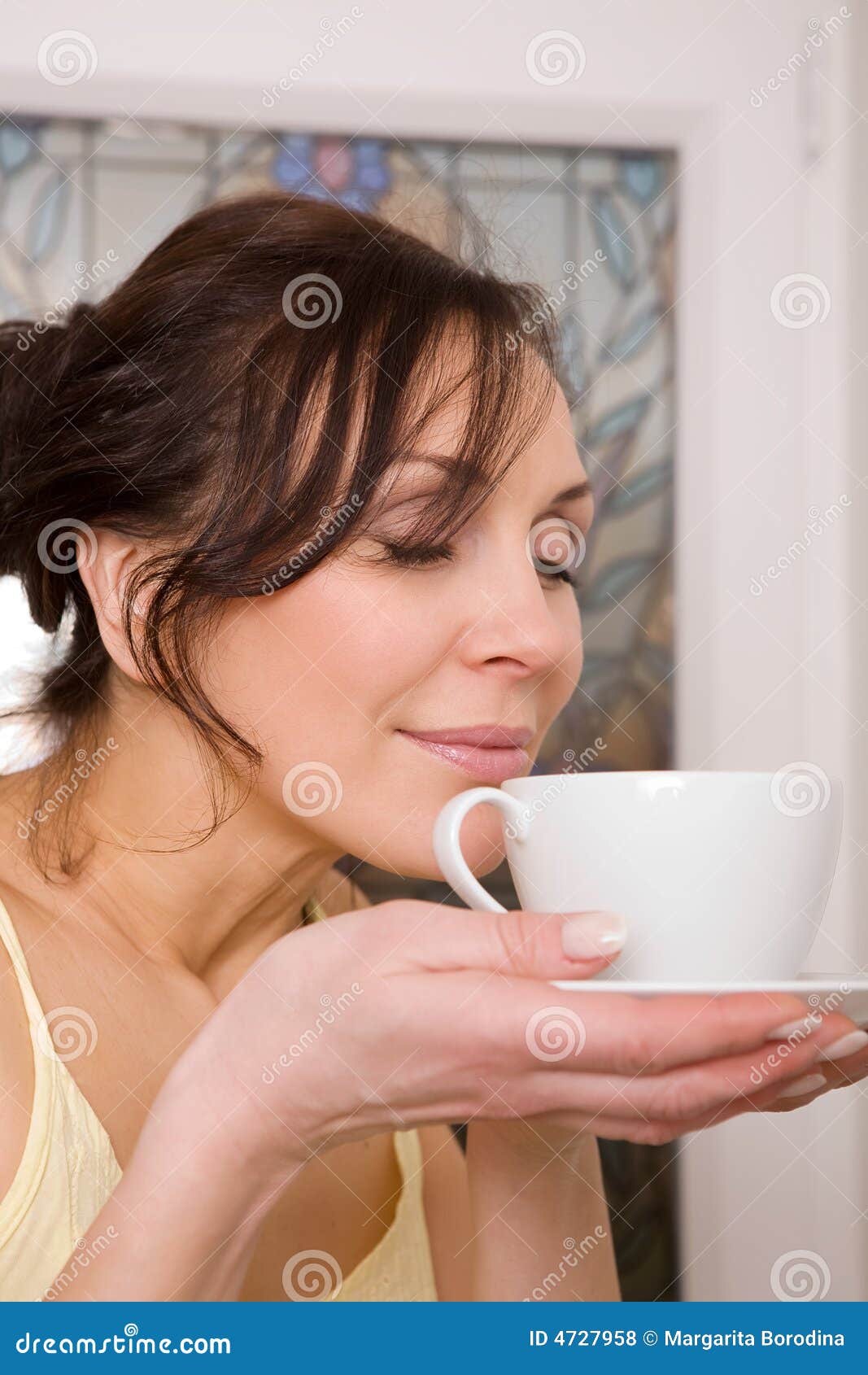 Young Woman Enjoying a Cup of Tea Stock Photo - Image of glowing ...