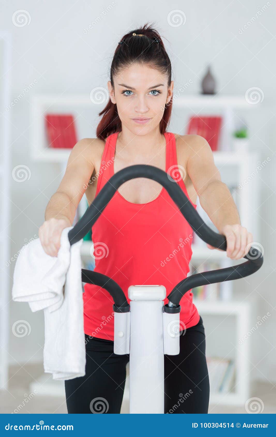 Young Woman on Exercise Machine Stock Photo - Image of routine, young ...