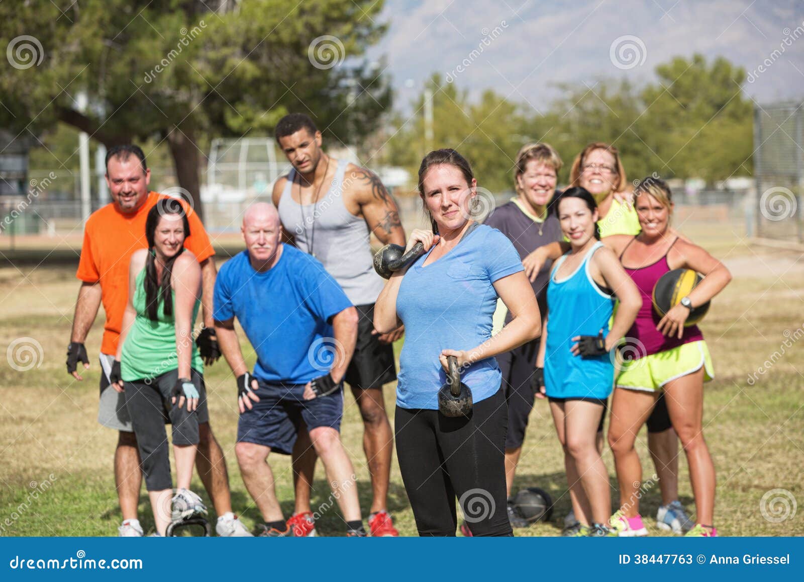 Young Woman Exercising with Group Stock Image - Image of active ...