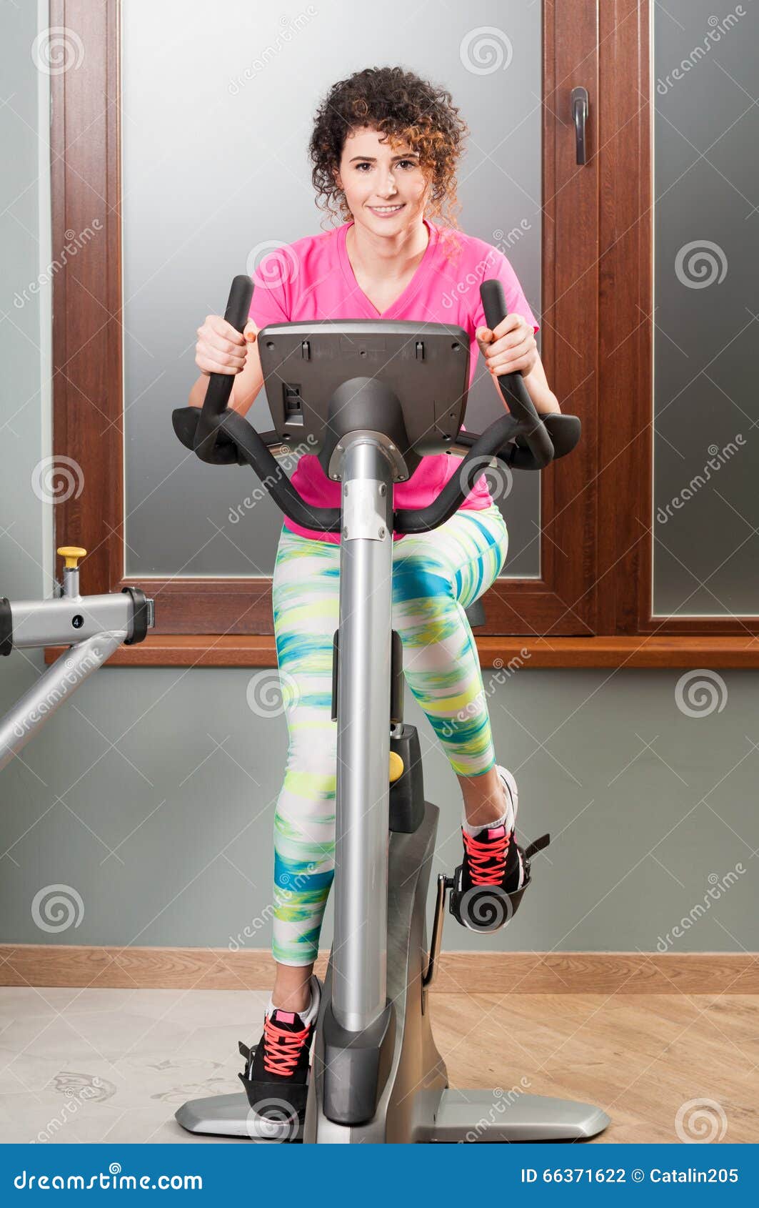 Young Woman Exercising and Training on Bicycle Stock Photo - Image of ...