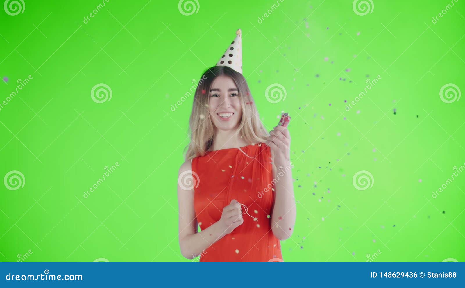 Young Woman Exploding Confetti Cracker on a Green Screen . Stock ...