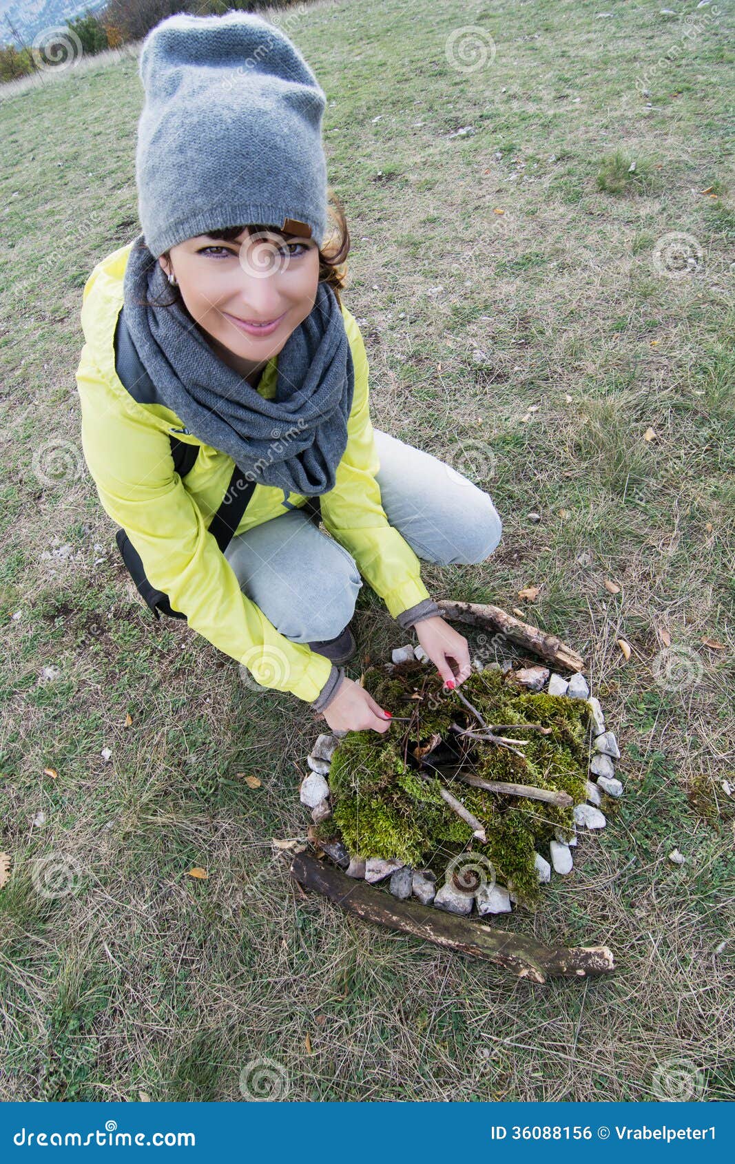 Young Woman and Extinct Campfire Lined with Green Moss Stock Photo ...