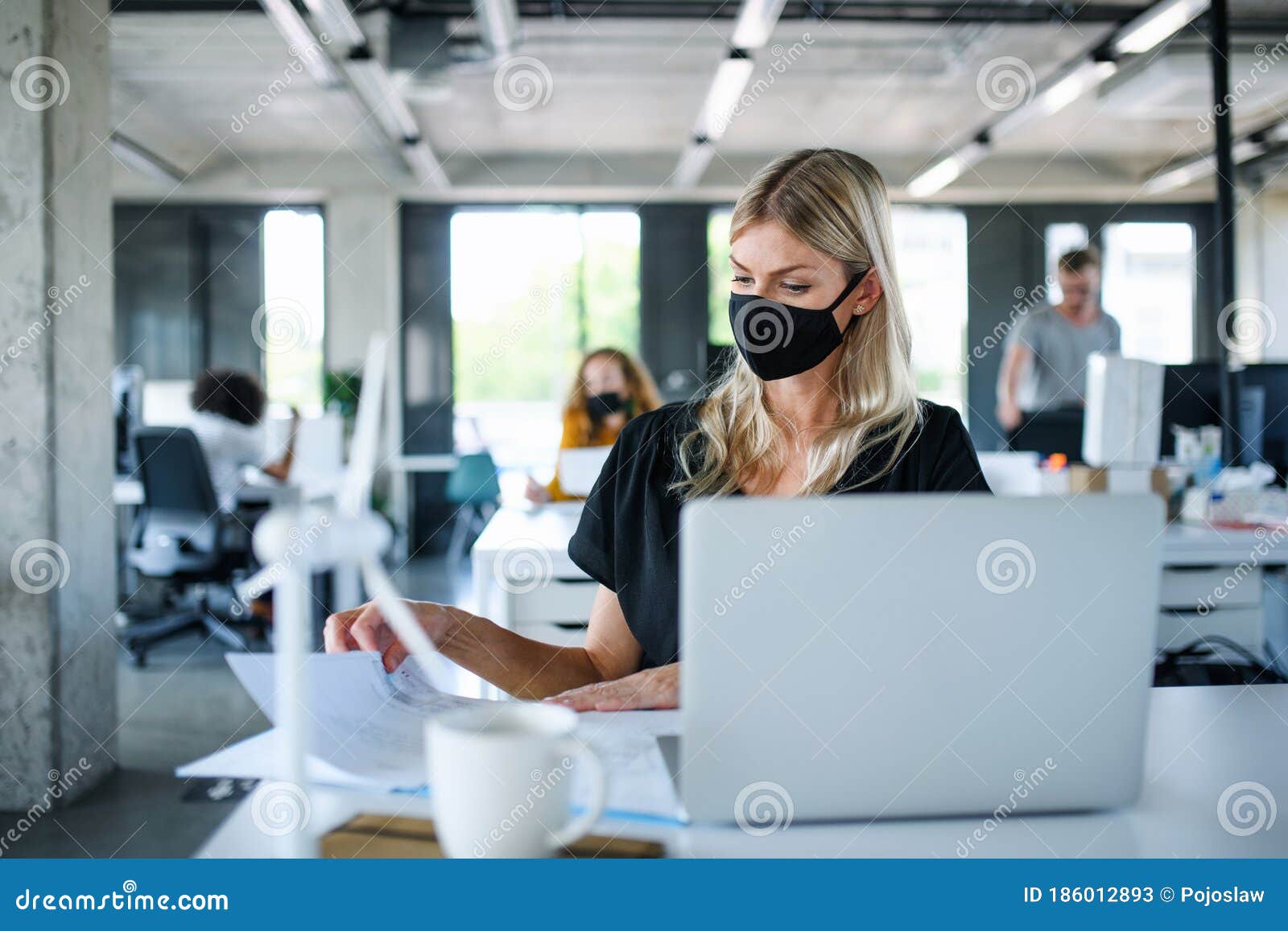 Young Woman with Face Mask Back at Work in Office after Lockdown ...