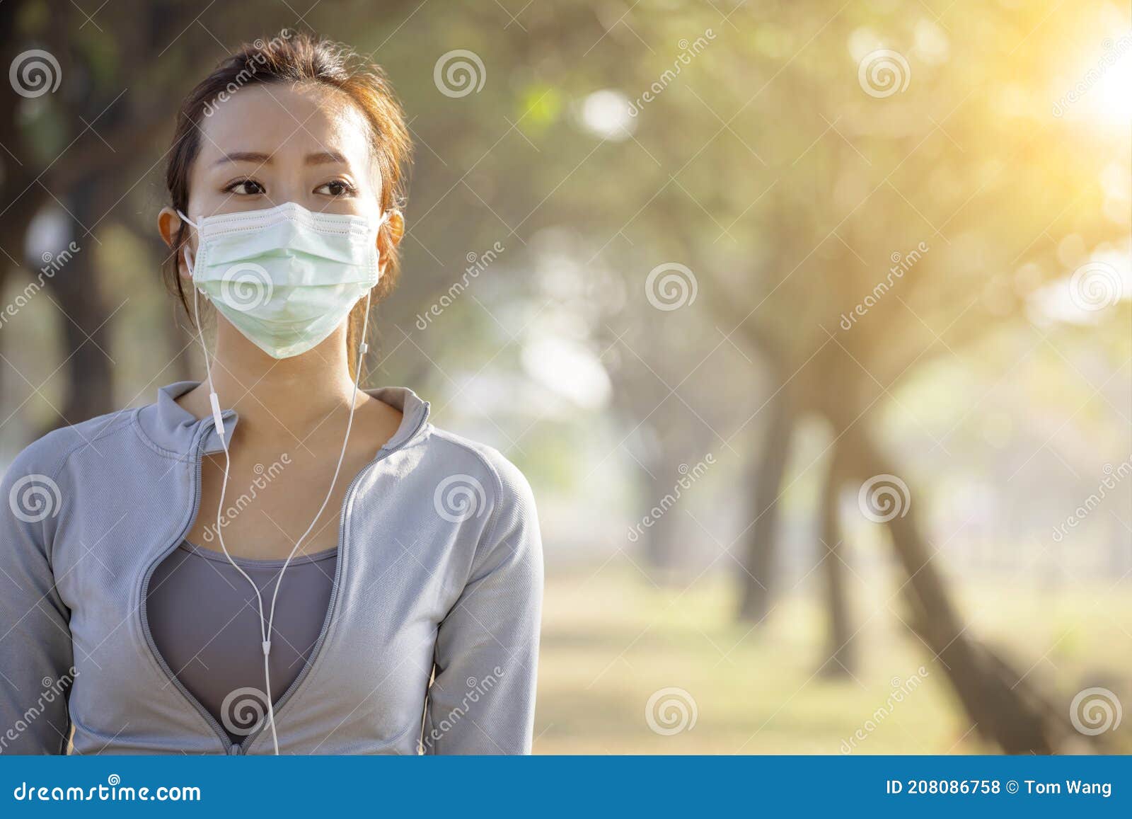 Young Woman in Face Mask and Ready Jogging in the Park Stock Photo ...